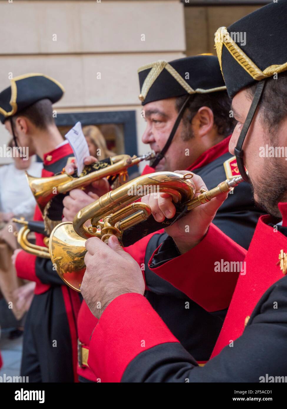 Uniformed members of brass bands clubs take part in a parade and ...