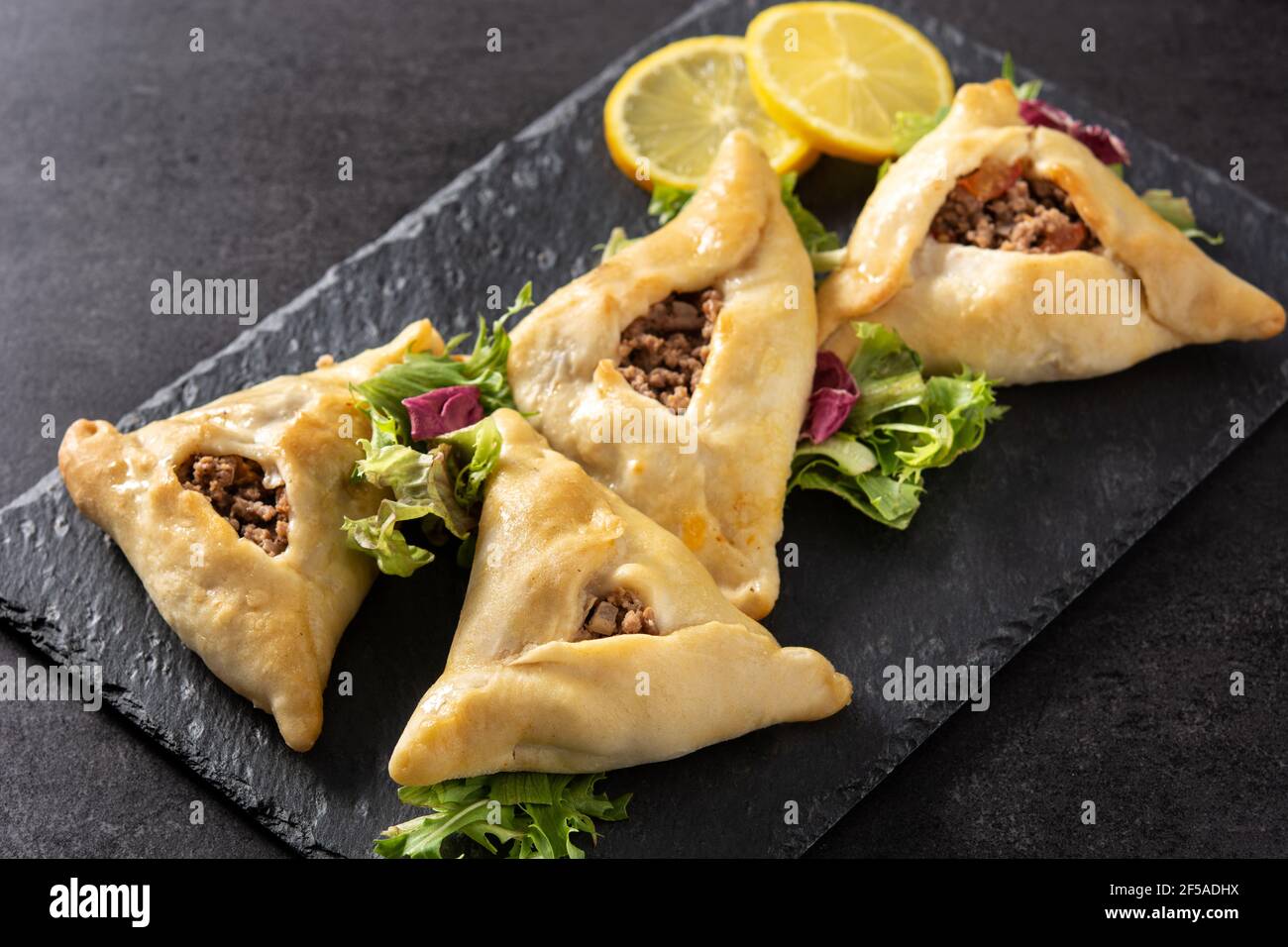 Traditional middle eastern fatayer on black slate background Stock ...