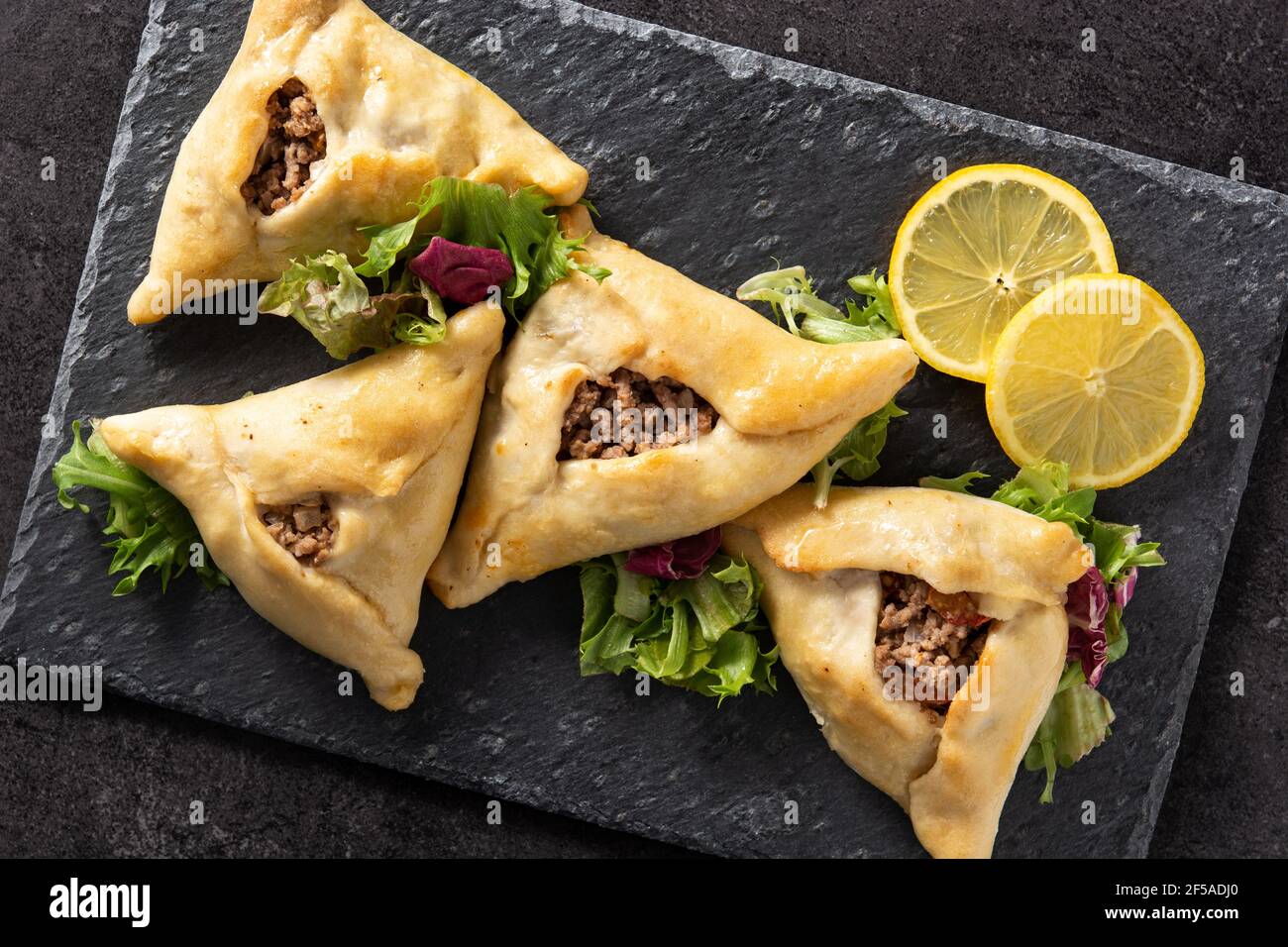 Traditional middle eastern fatayer on black slate background Stock ...