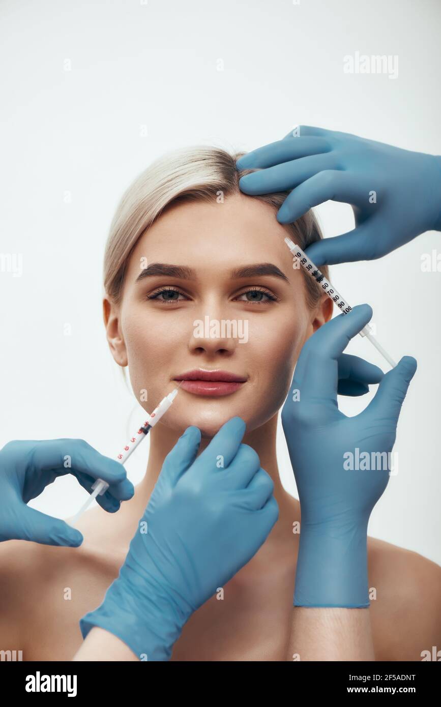 Creating beauty. Portrait of young pretty woman looking at camera and ...
