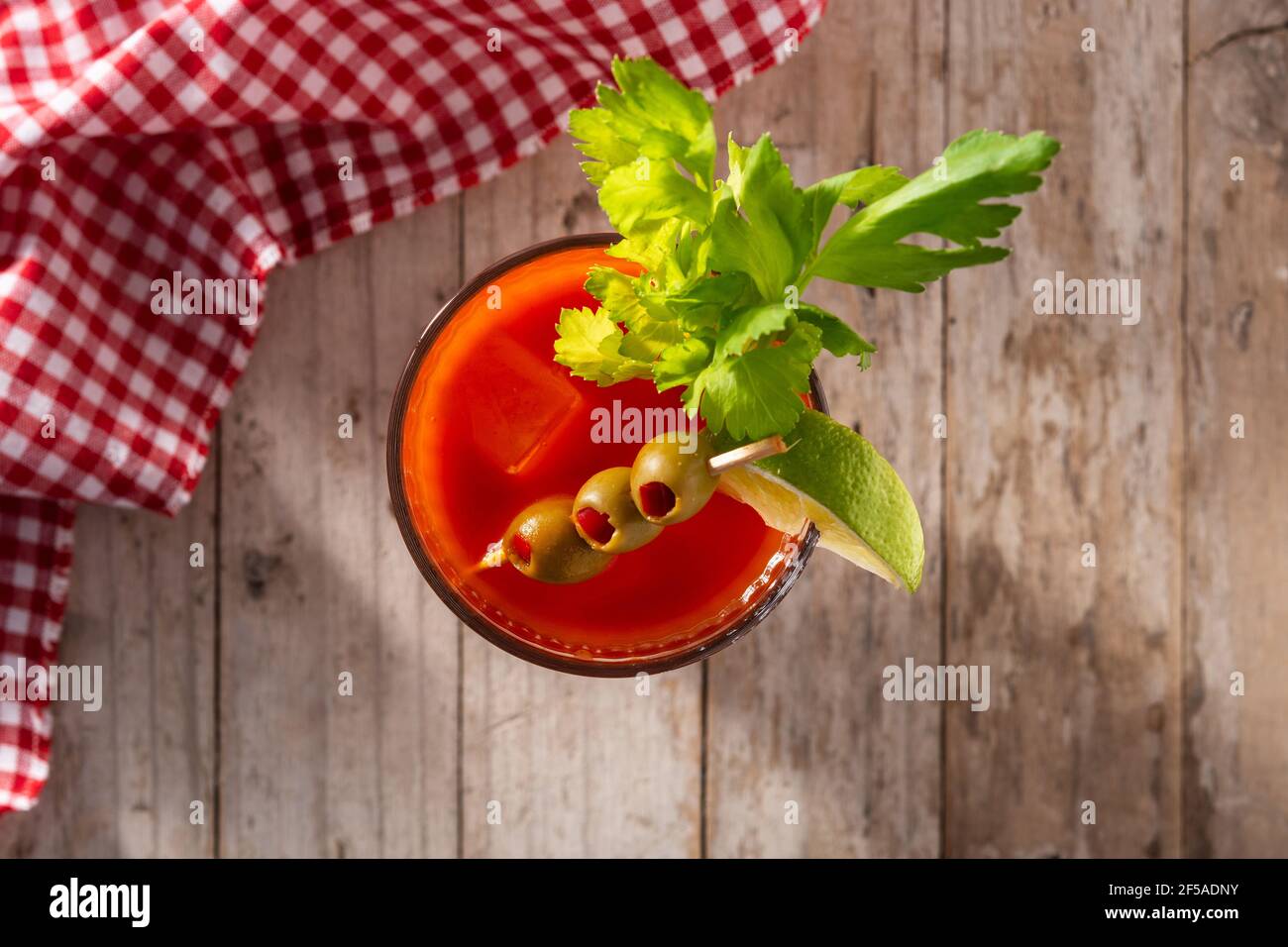 Bloody Mary cocktail in glass on wooden table Stock Photo - Alamy
