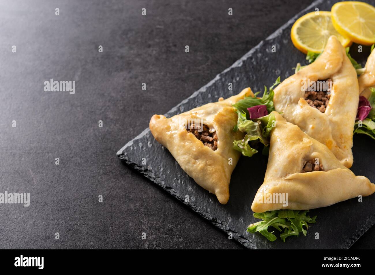 Traditional middle eastern fatayer on black slate background Stock ...