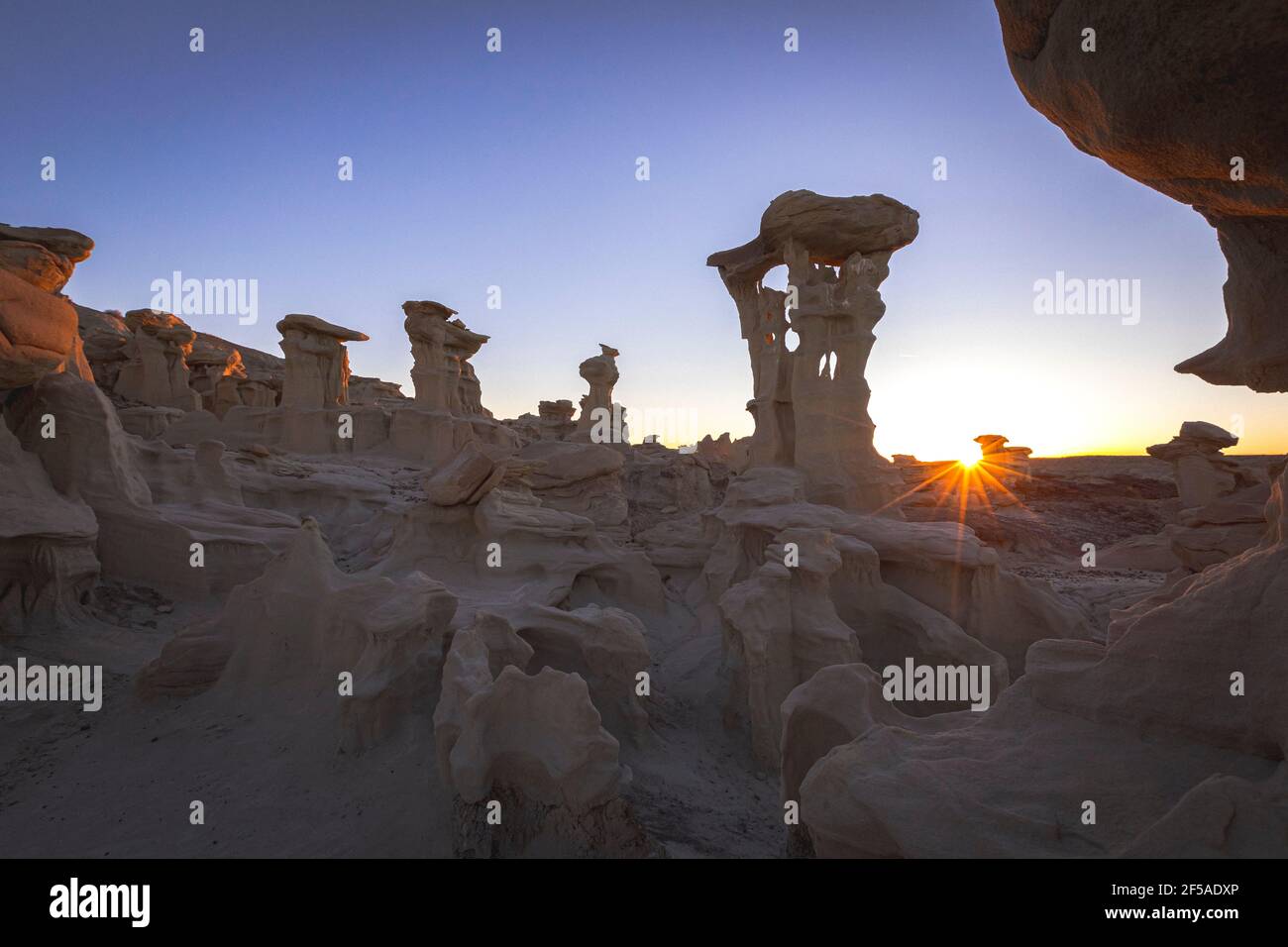 The sun and the Alien throne rock formation, Bad Lands, New Mexico ...