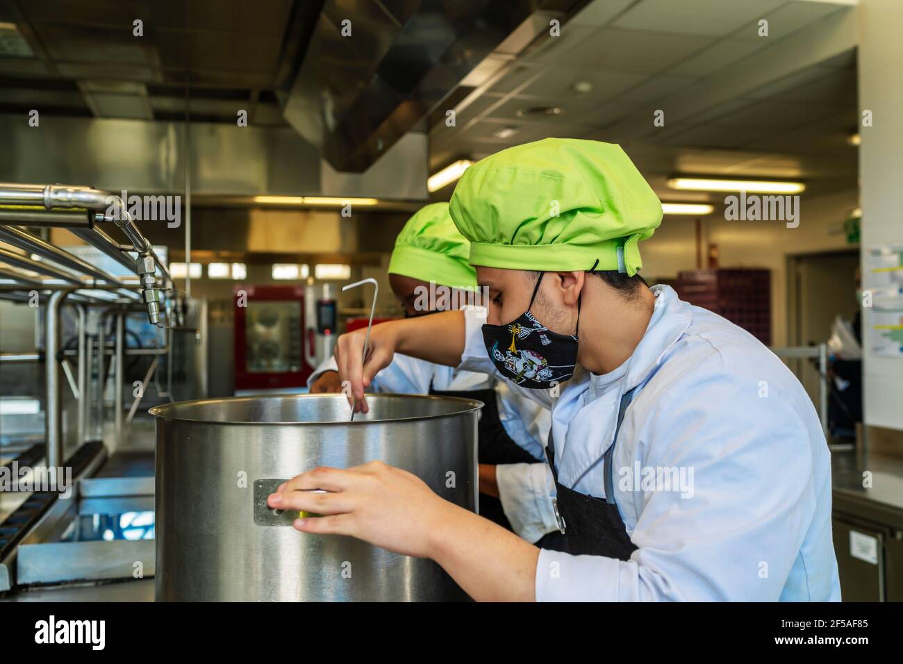 chef students preparing a menu Stock Photo - Alamy