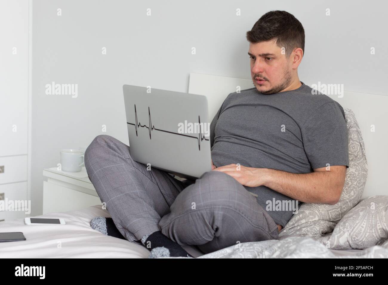 Sick man in bed hi-res stock photography and images - Alamy