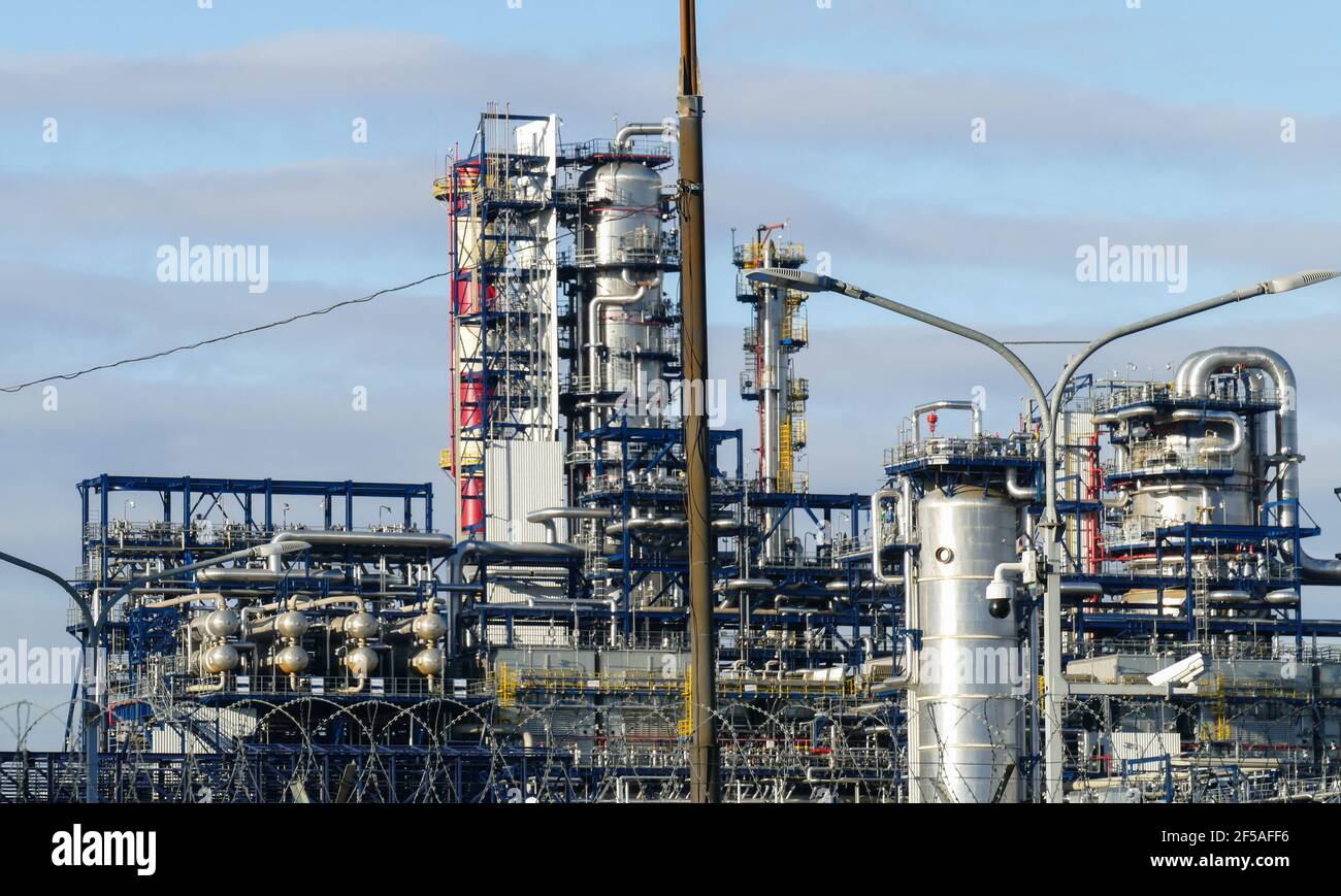 Corps of Moscow refinery in spring in clear weather 2021 Stock Photo ...
