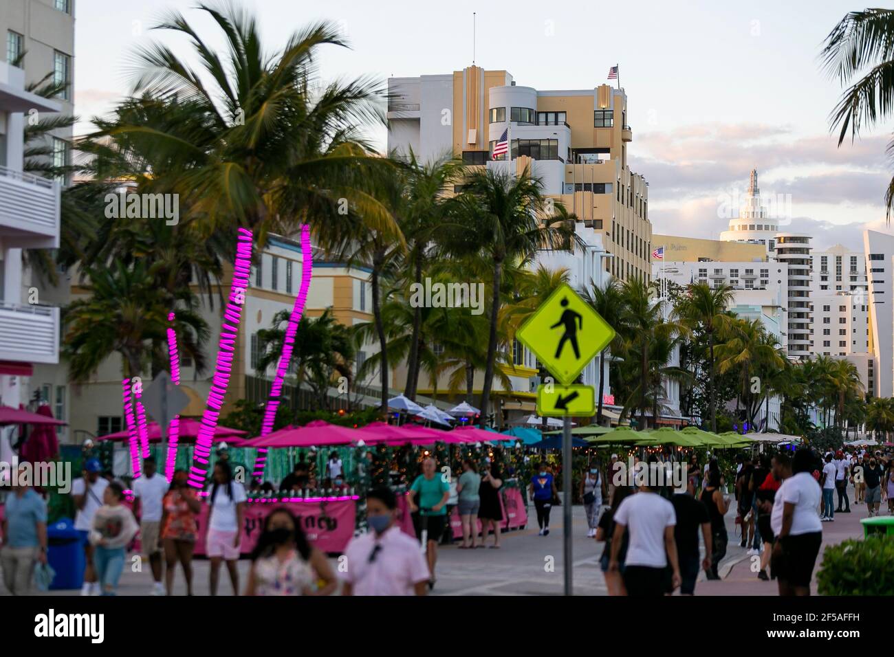 Tourists make their way down Ocean Drive during Spring Break in Miami ...