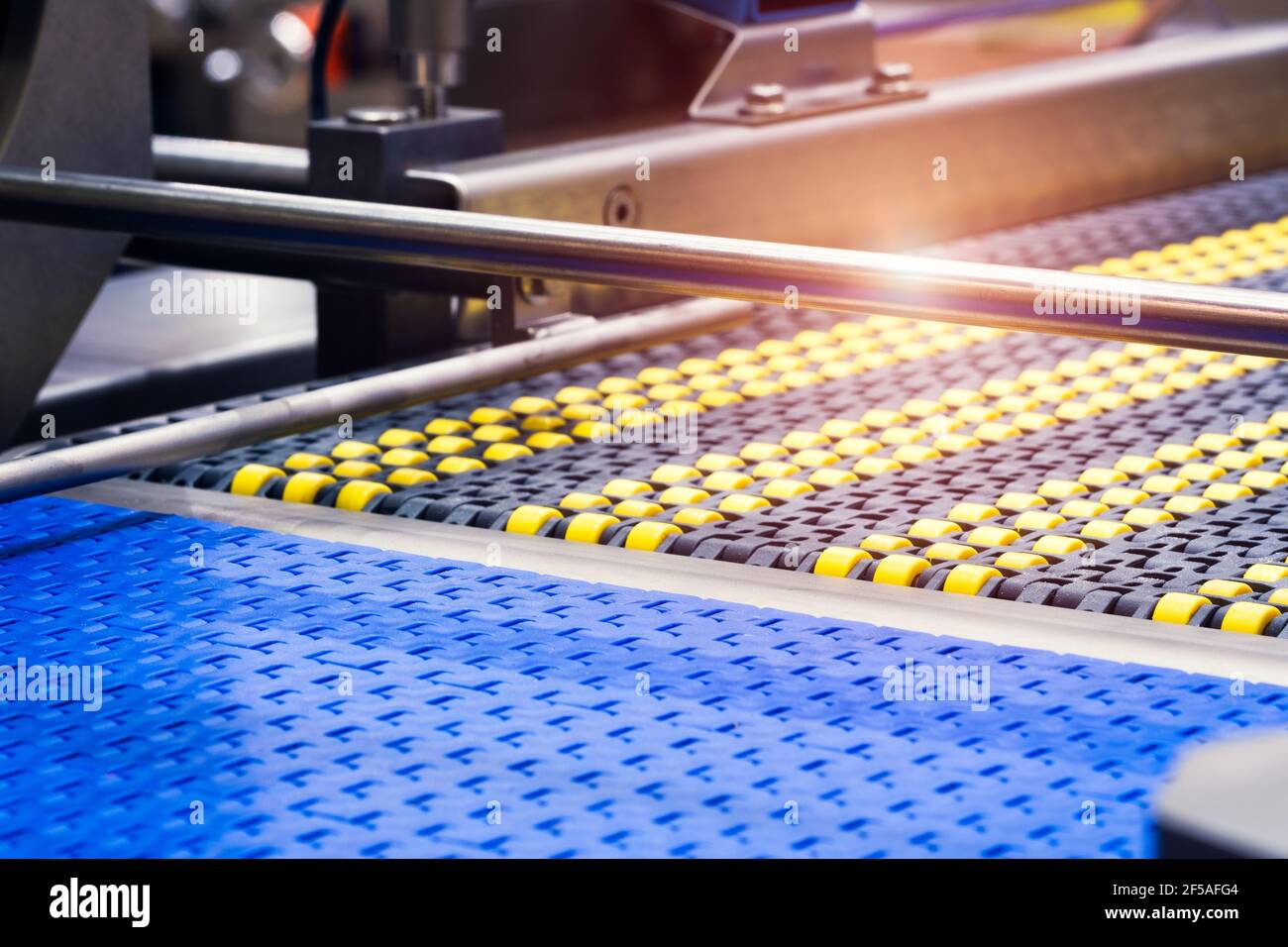 Empty conveyor belt of production line, part of industrial equipment ...