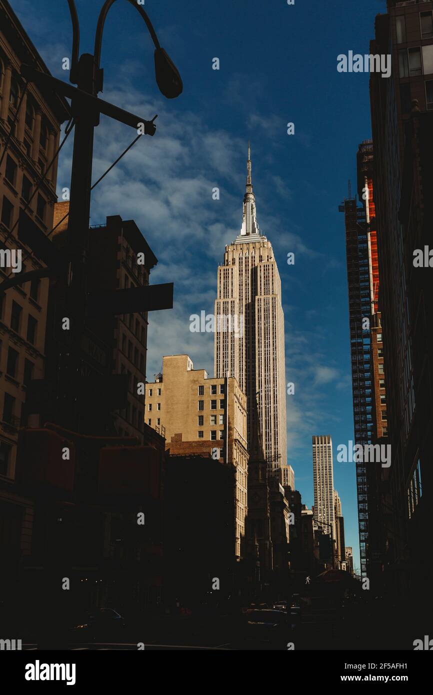 Empire State Building in sunshine from below Stock Photo - Alamy