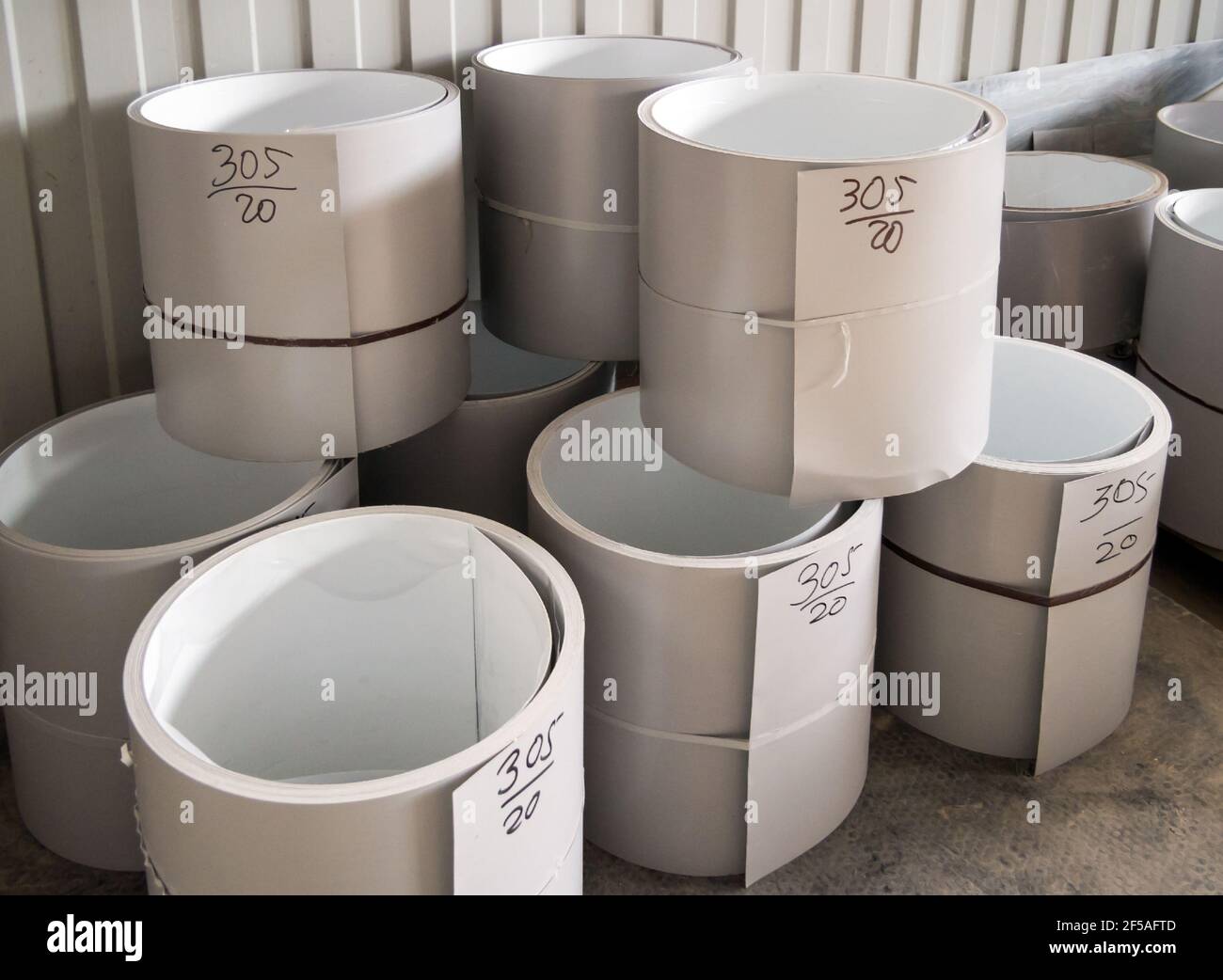 Coils of polymer coated sheet metal strips Stock Photo - Alamy