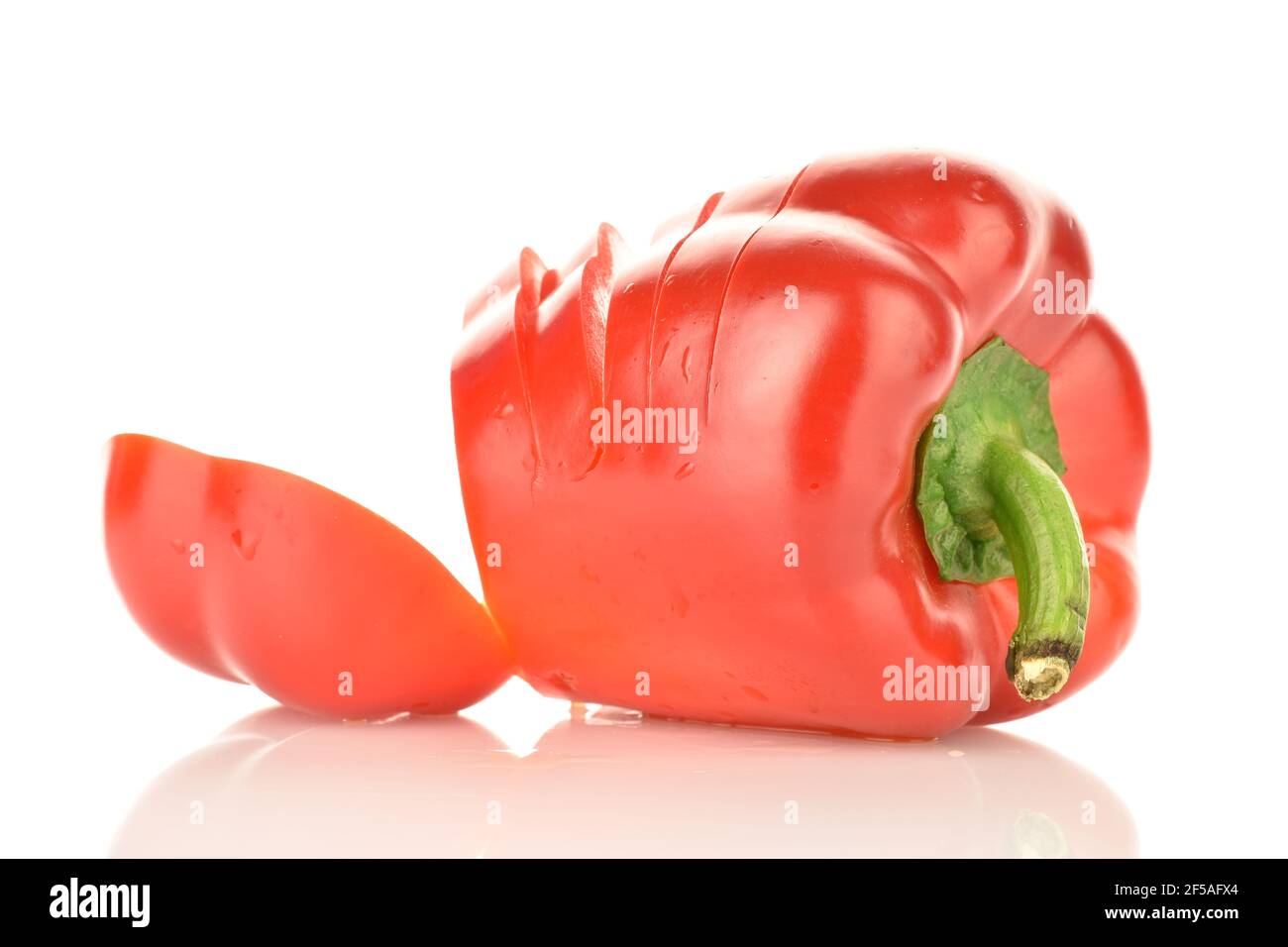 Red bell pepper cut into slices, close-up, isolated on white Stock ...