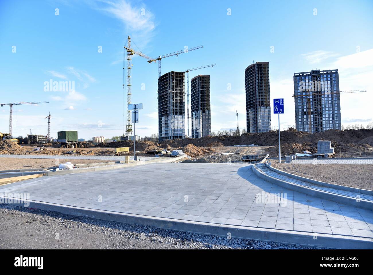 Installing paving bricks in the town pedestrian zone. Laying paving ...