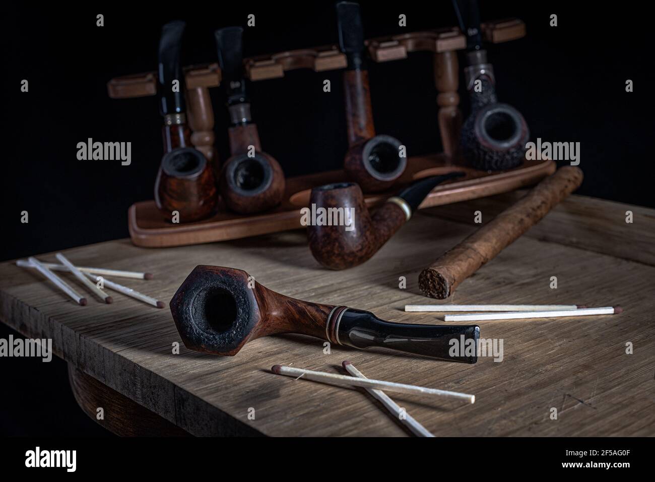 Smoking pipes of different shapes and types in a special rack Stock ...