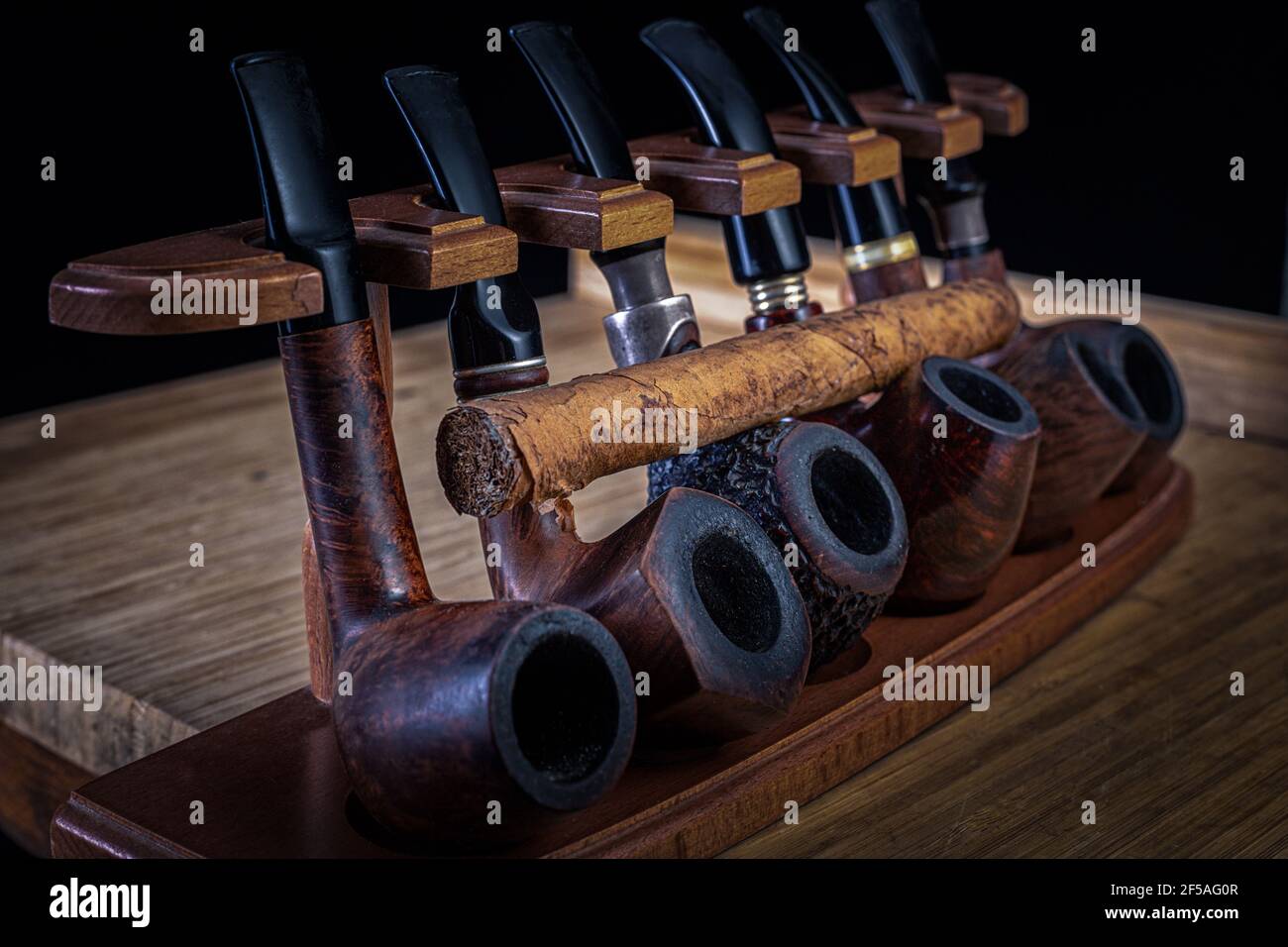 Smoking pipes of different shapes and types in a special rack Stock ...