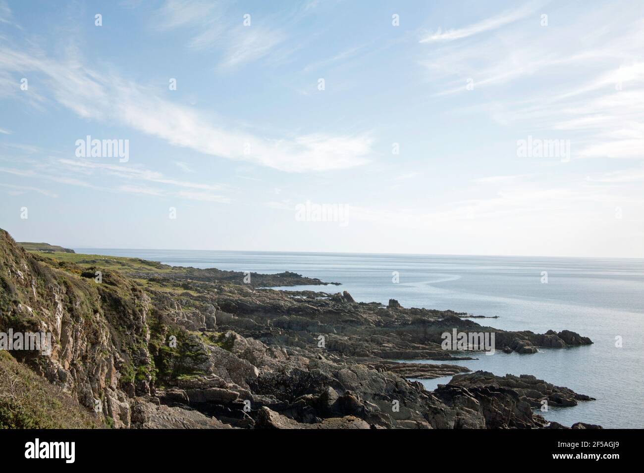 The Rocky shoreline at Torrs Point at the mouth of Kirkcudbright Bay ...