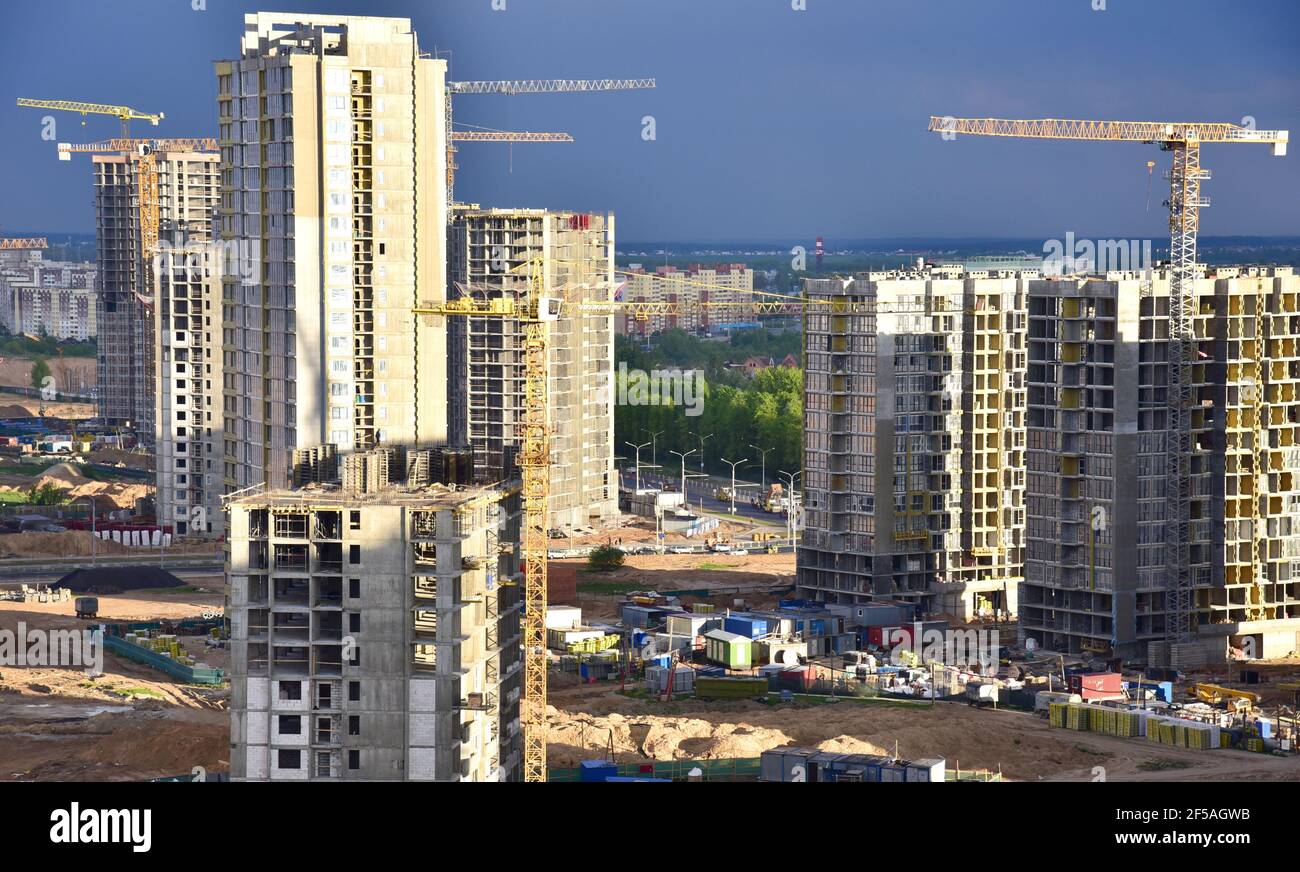 View on the large construction site at urban area. Tower cranes in ...