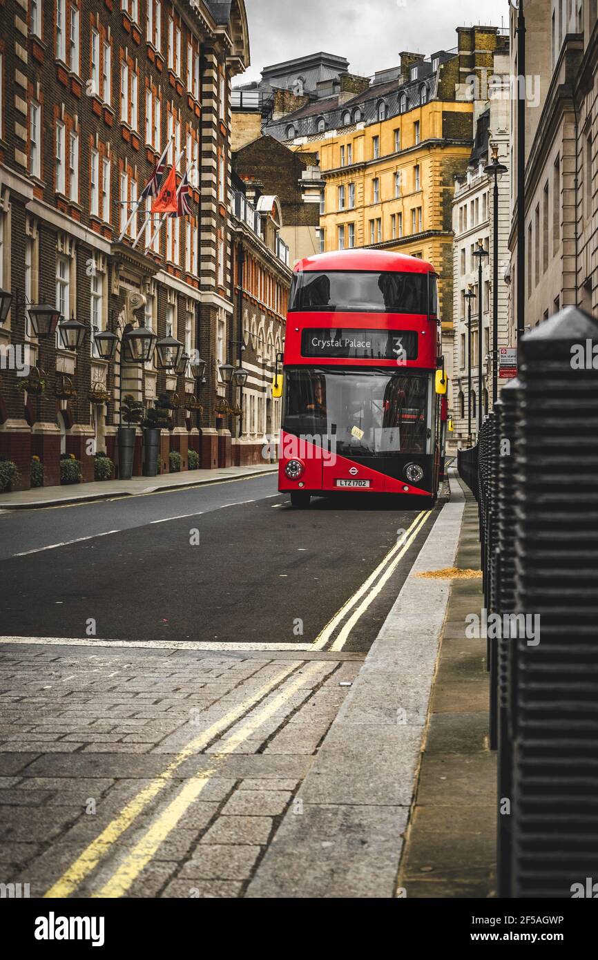 Big Red Bus parked on a street somewhere in London, England Stock Photo ...