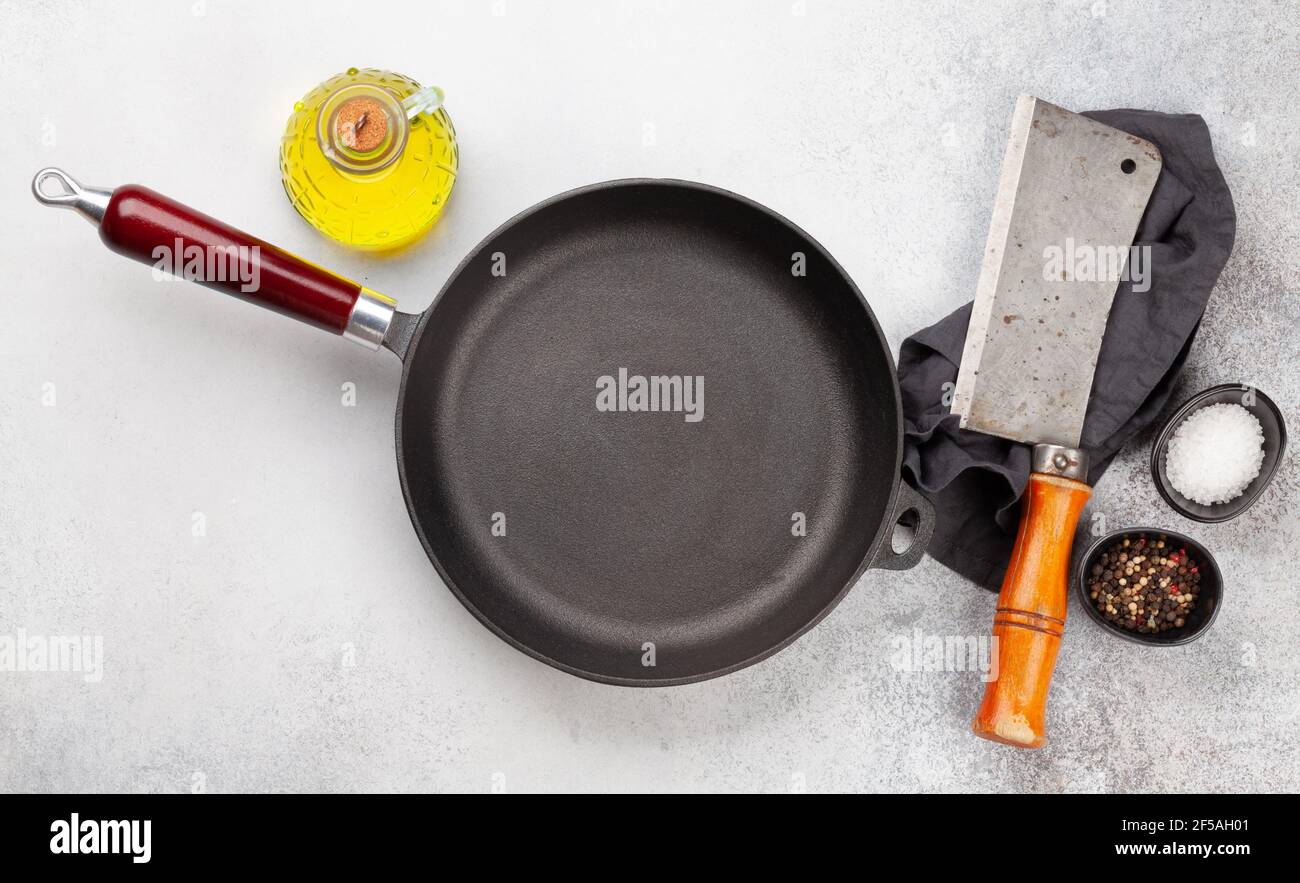 Frying pan, utensils and ingredients on kitchen table. Top view flat ...
