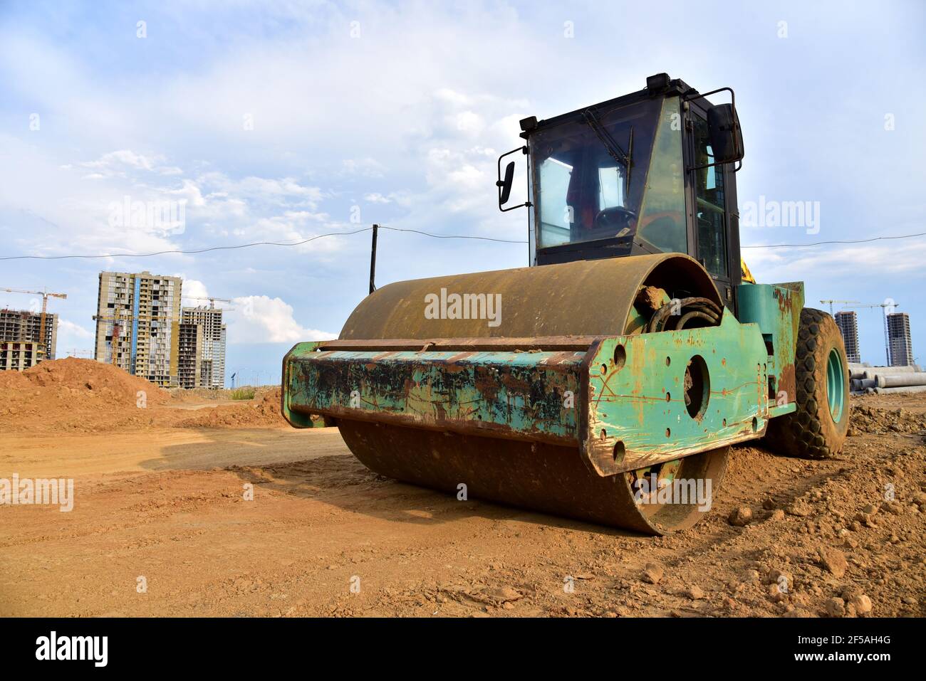 Vibro Roller Soil Compactor Leveling Ground At Construction Site