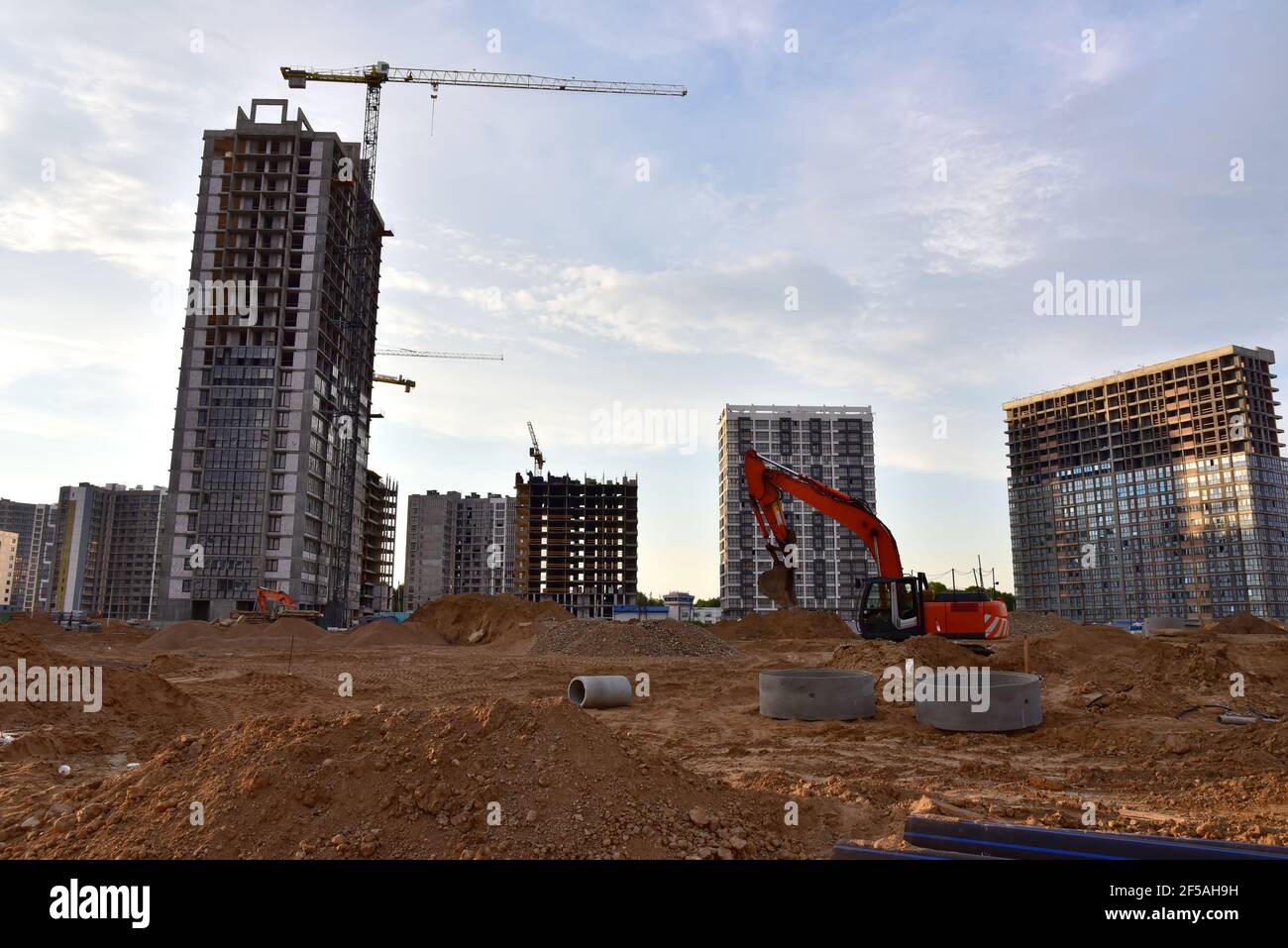 Excavator on earthmoving at construction site. Road work and Dig pit ...