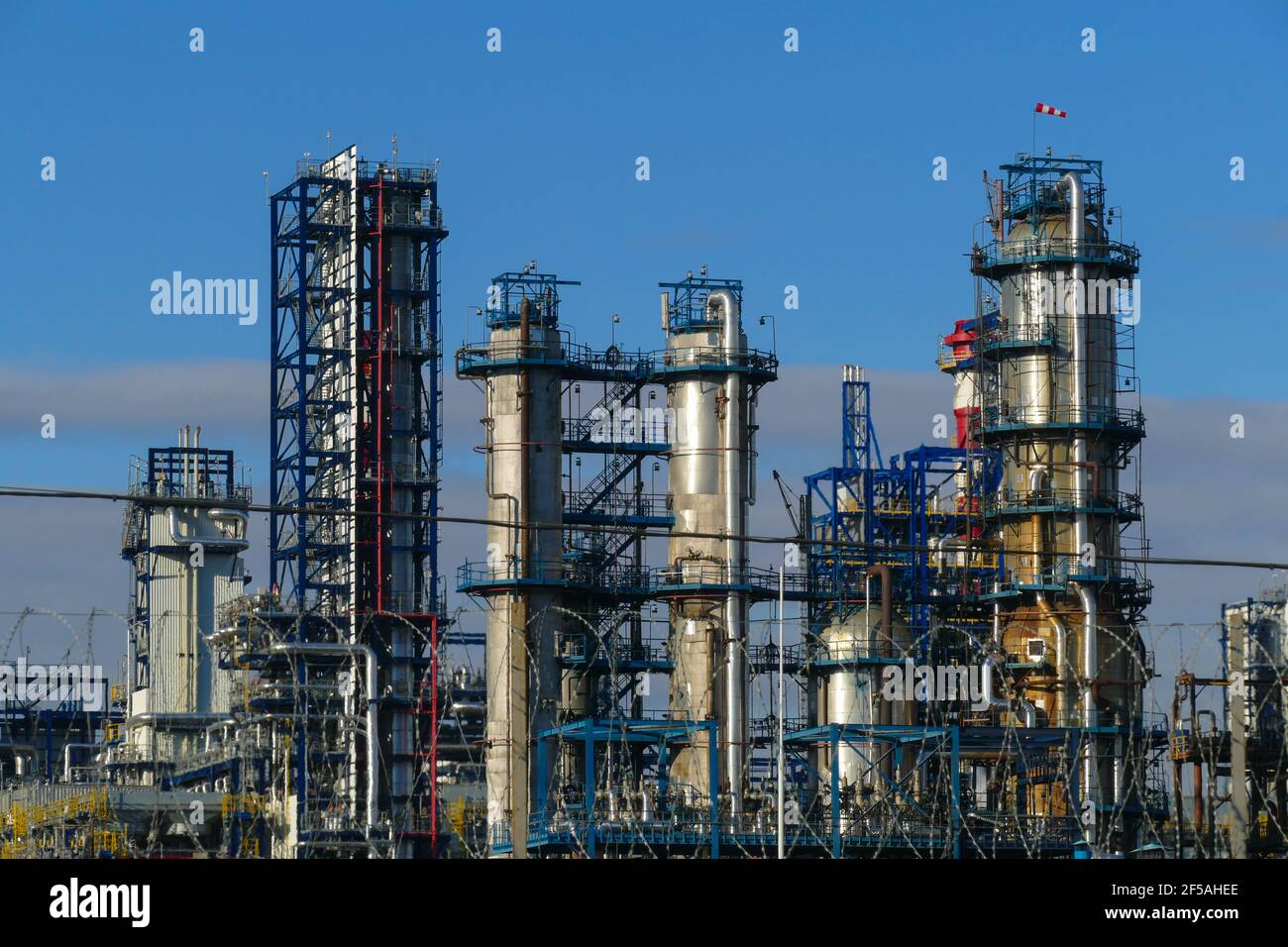 Corps of Moscow refinery in spring in clear weather 2021 Stock Photo ...