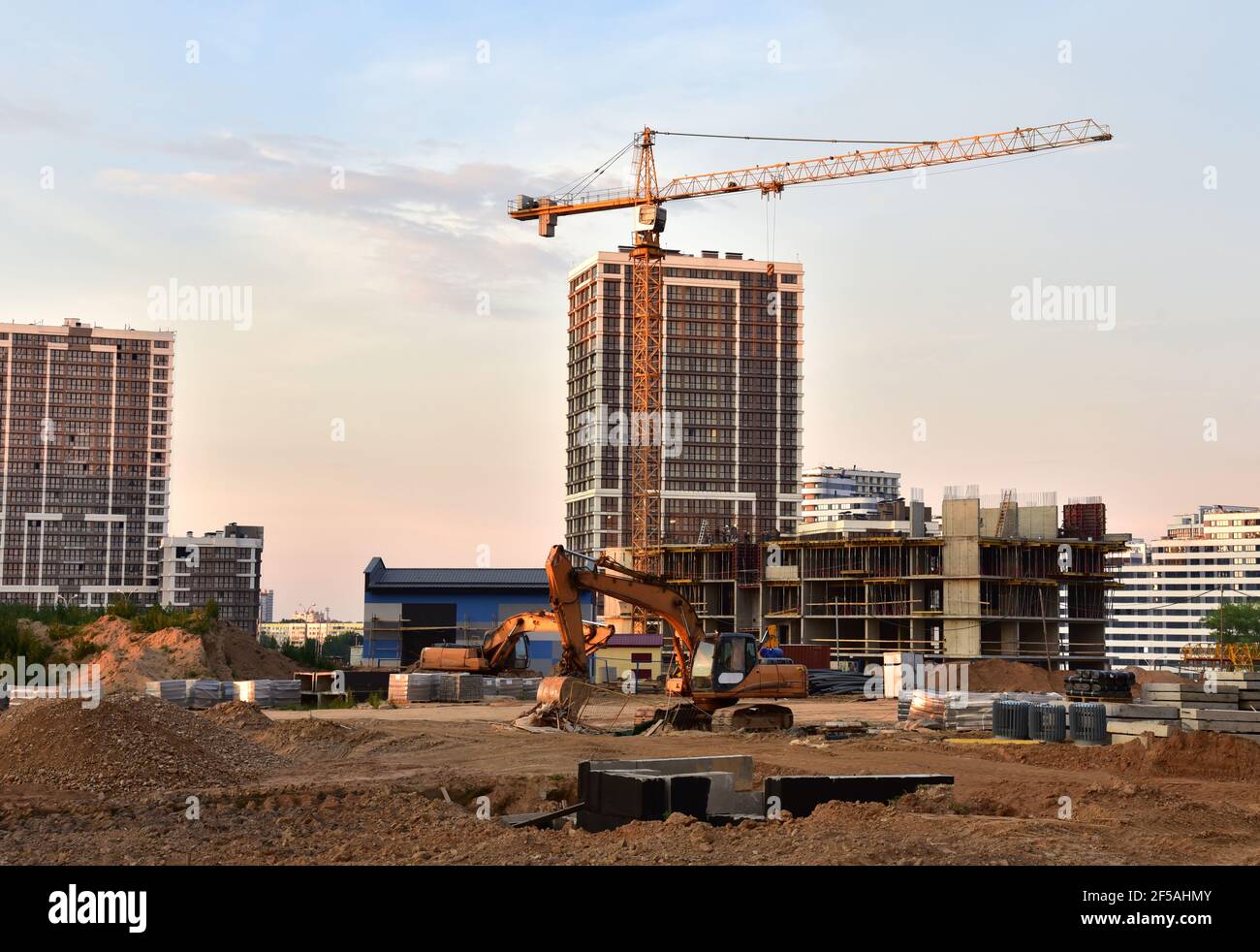 Excavator on earthmoving at construction site. Road work and Dig pit ...