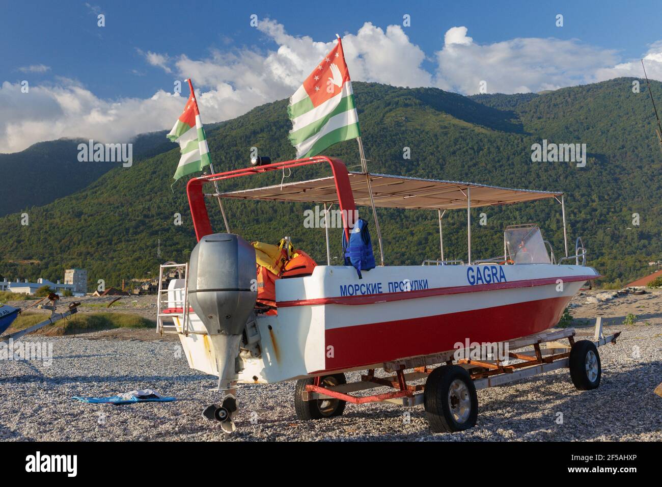 Sea boat. View from a beach of Gagra Town, July of 2018, Abkhasia Stock ...