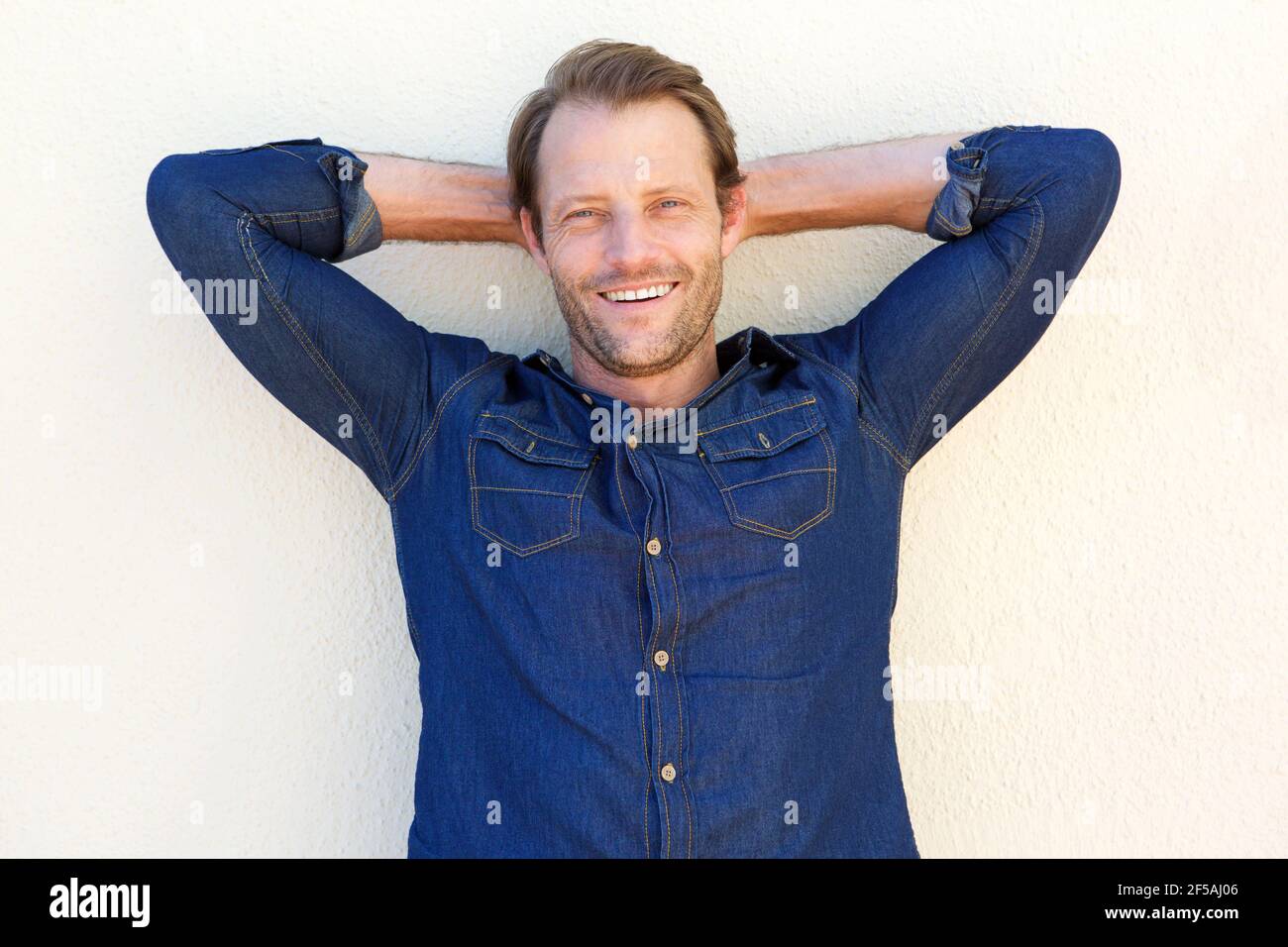 Male model hands behind head hi-res stock photography and images - Alamy
