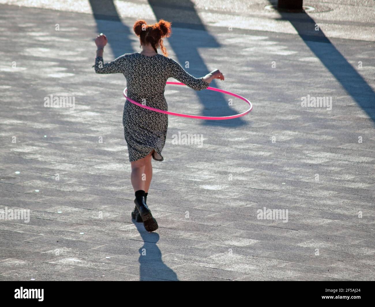 Woman hula hooping hi-res stock photography and images - Alamy