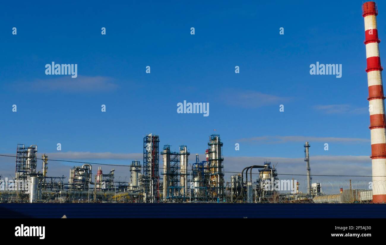 Corps of Moscow refinery in spring in clear weather 2021 Stock Photo ...