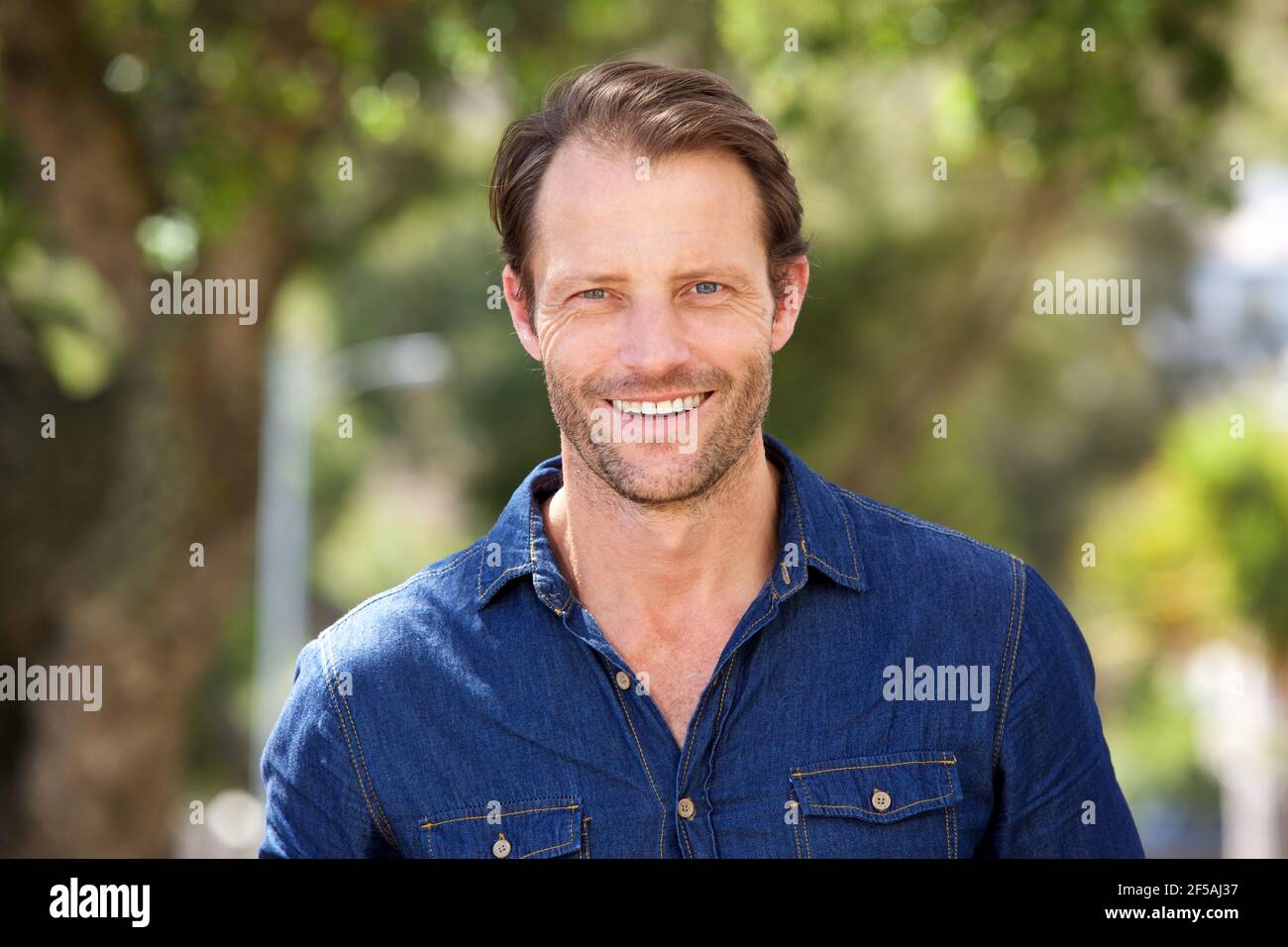 Attractive guy shirt outside hi-res stock photography and images - Alamy