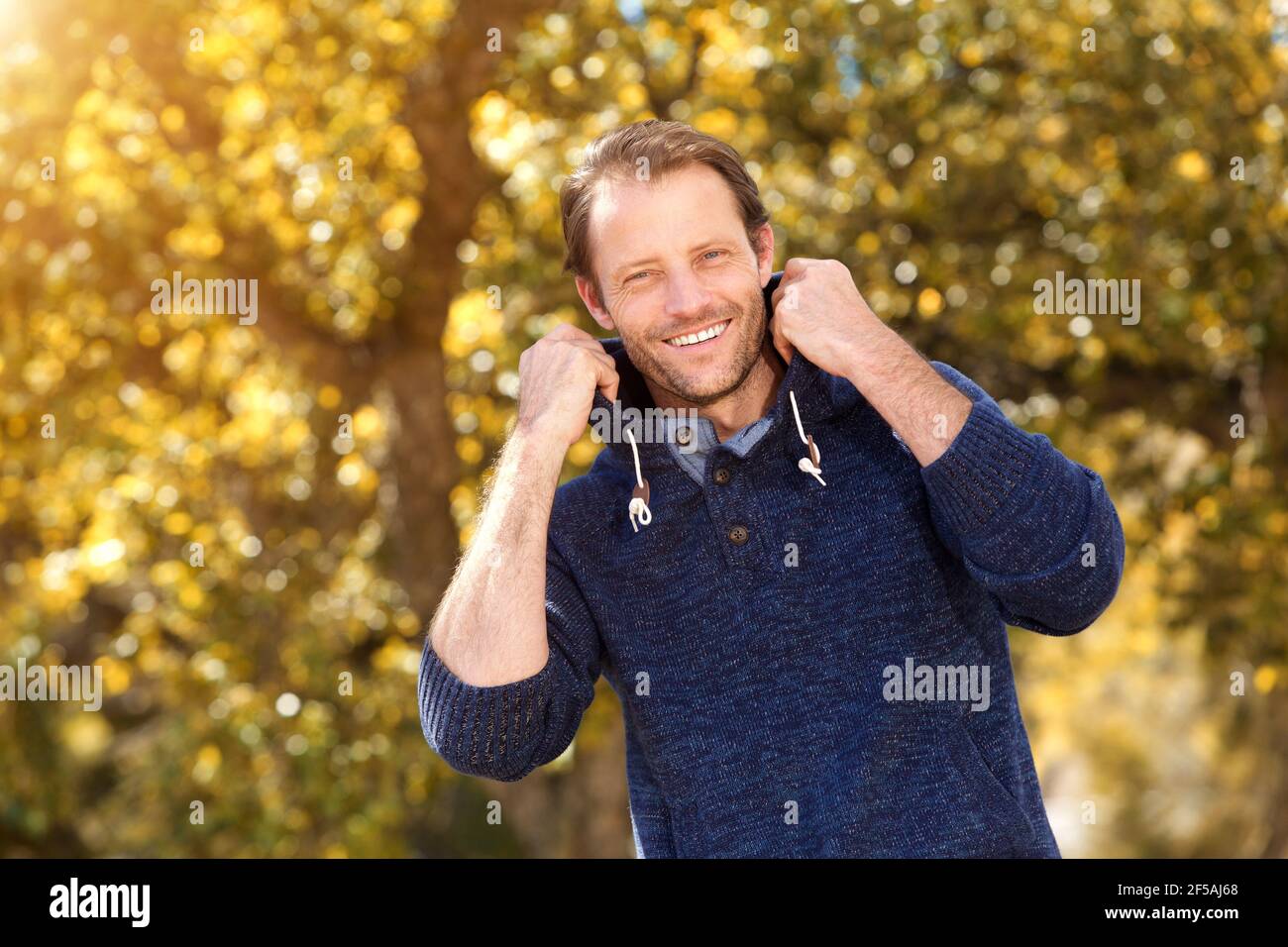 Portrait of happy older guy standing outside in autumn season Stock ...