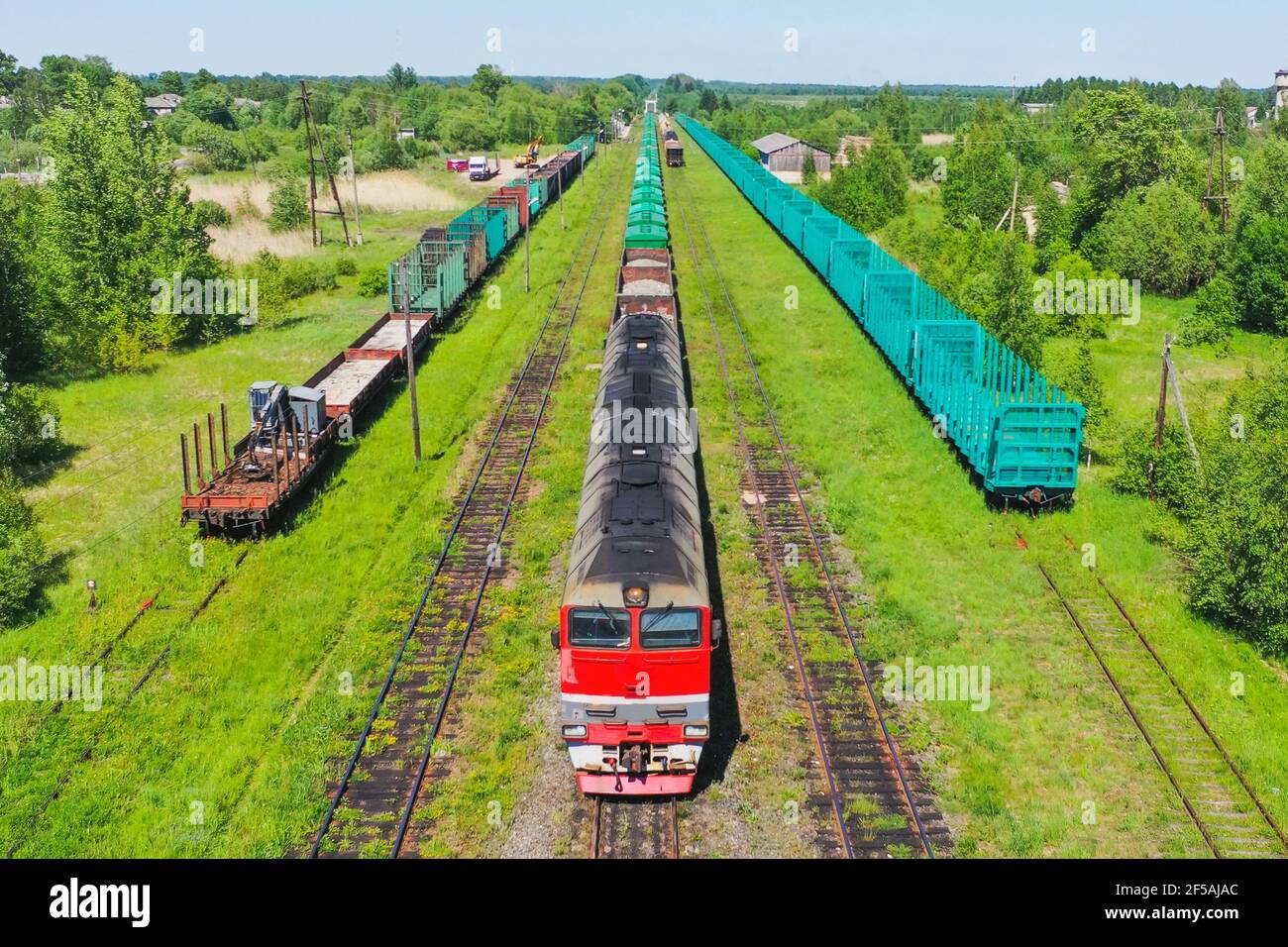 Aerial view of colorful freight trains. Cargo wagons on railway station ...