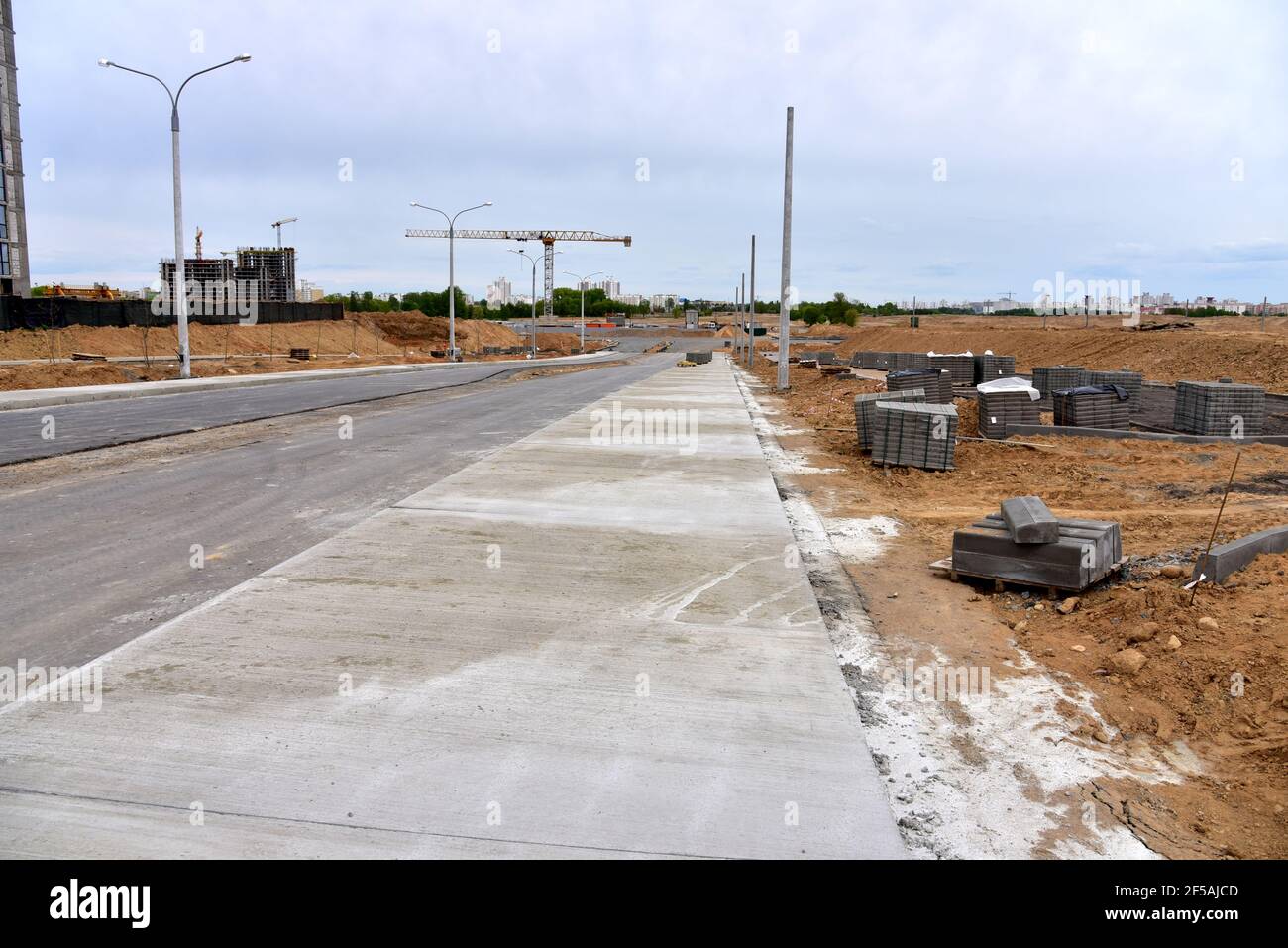 Road concreting at construction site. Concrete pavement. Construction ...