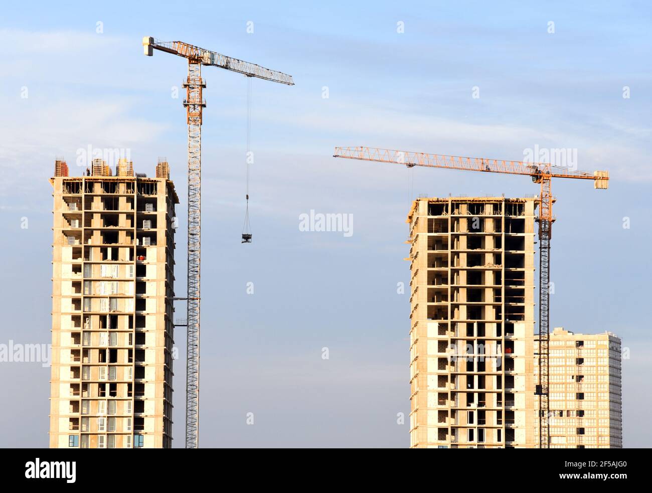 Preparing to pour a bucket of concrete into formwork.Tower crane ...