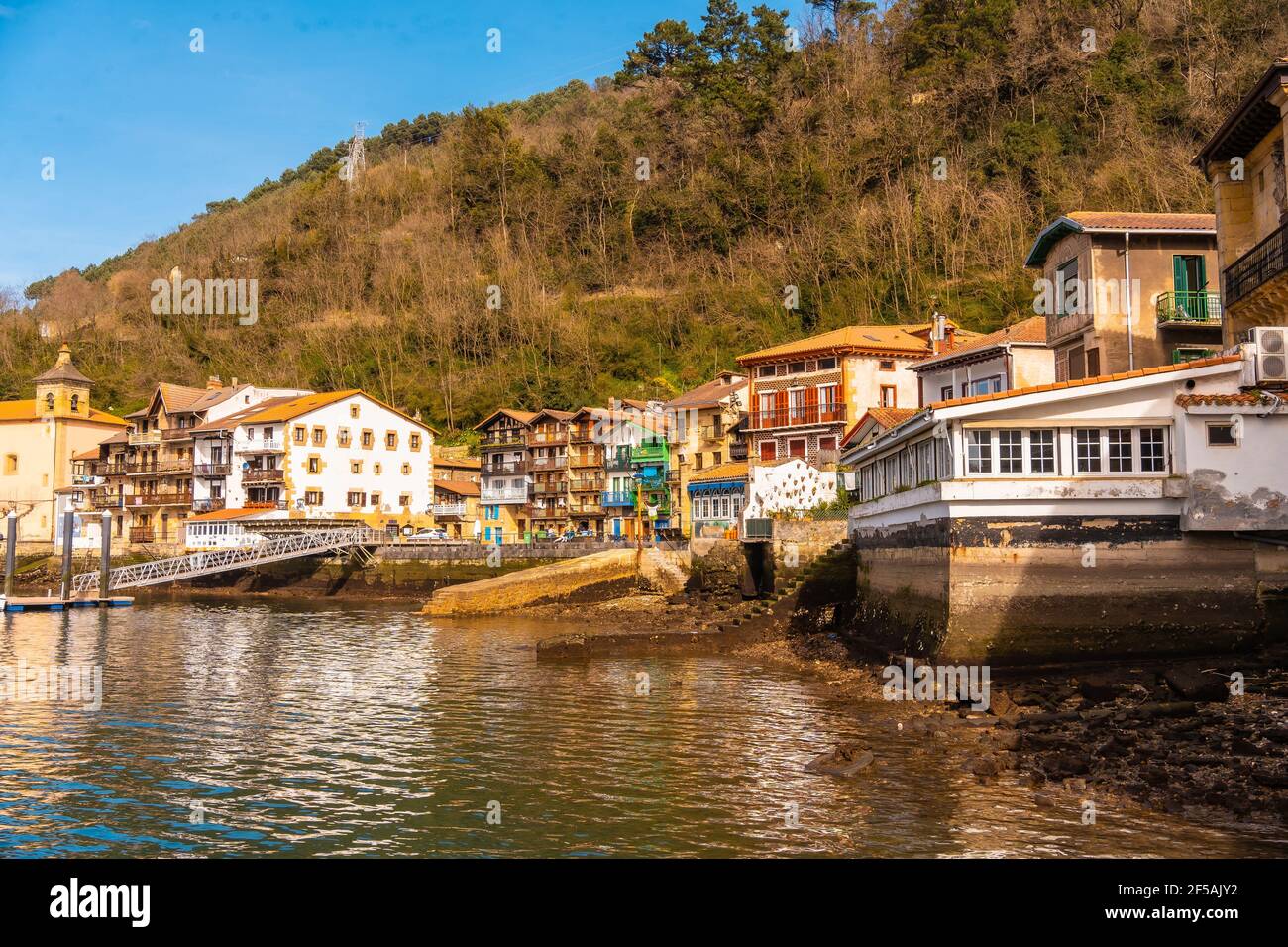 Beautiful coastal town Pasajes in Spain surrounded by greenery-covered ...