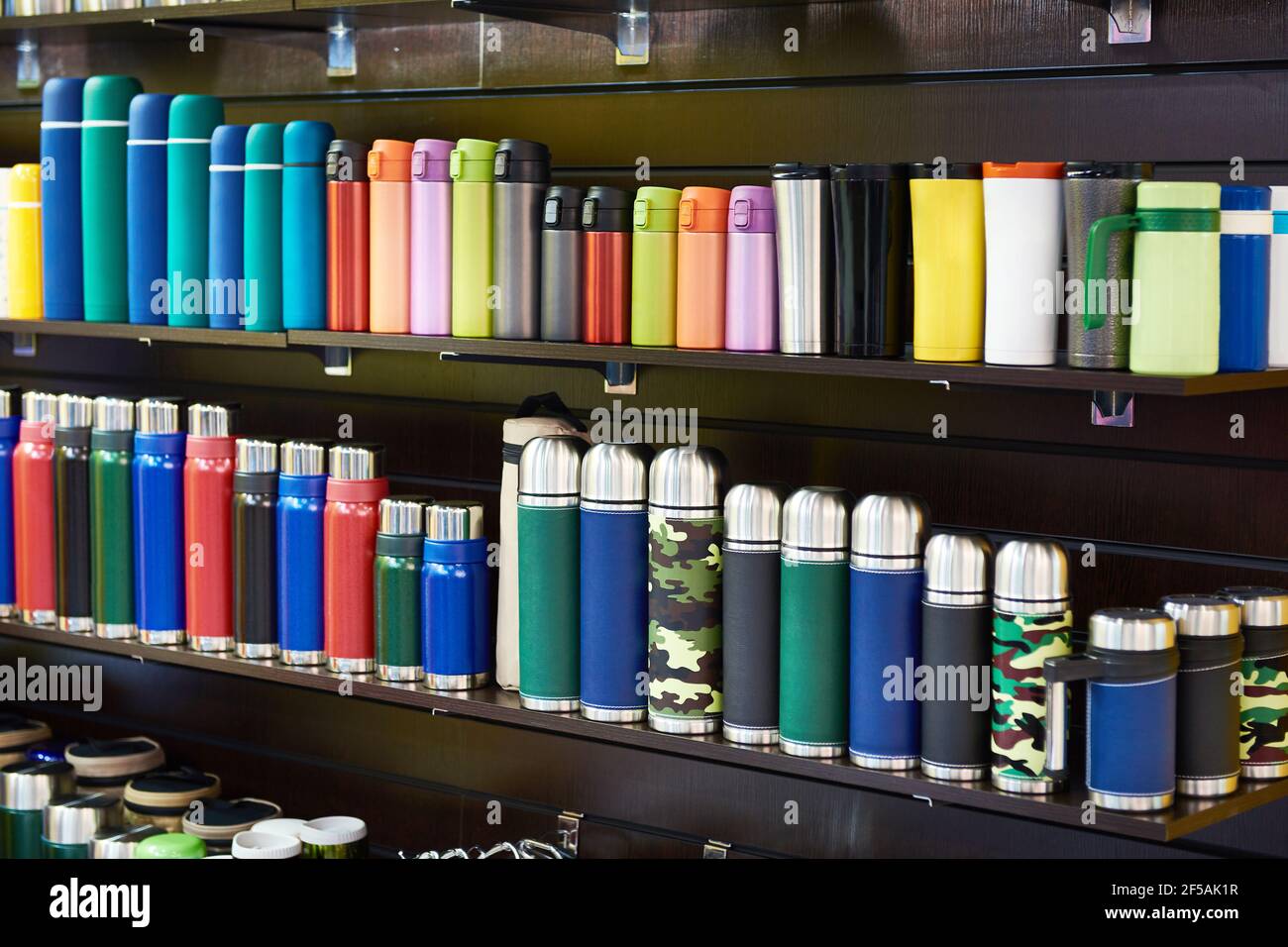 Colored thermos in the shop window Stock Photo - Alamy