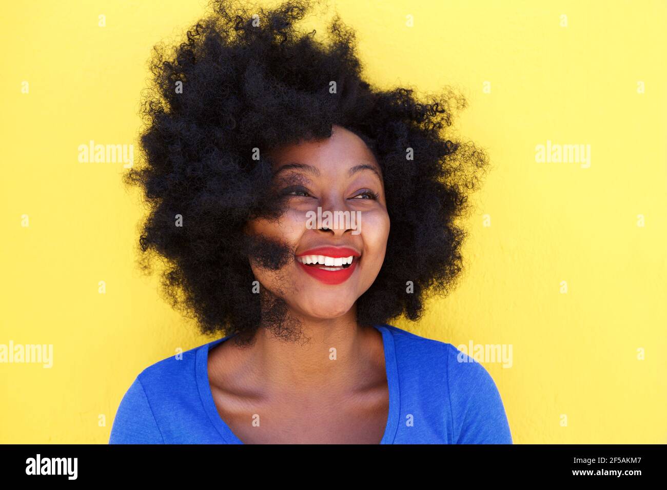 Cheerful young afro woman hi-res stock photography and images - Alamy