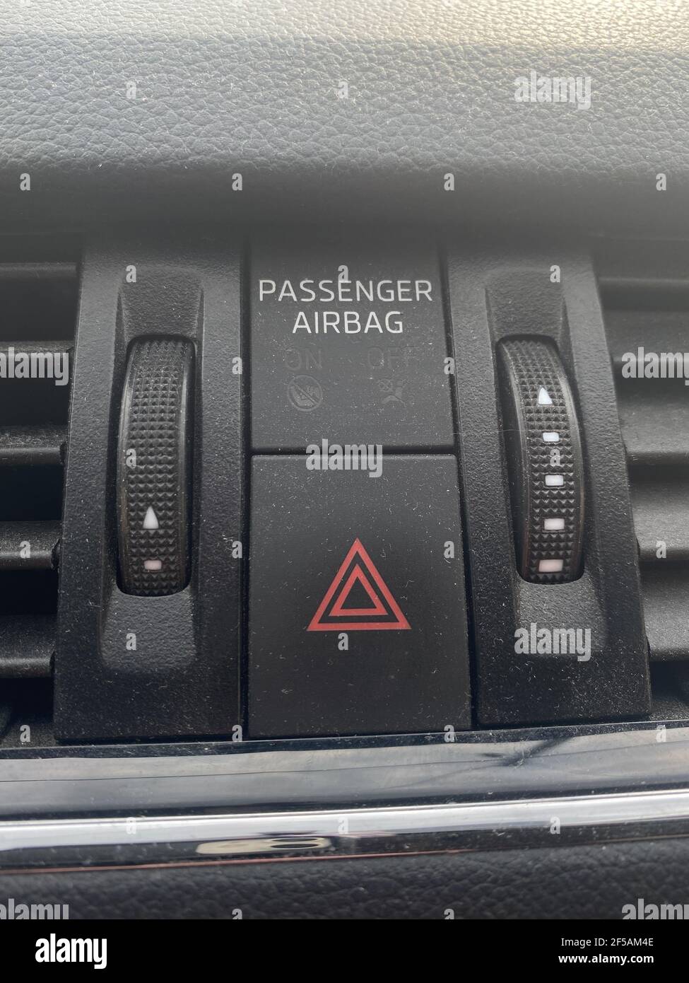 Passenger airbag on and off symbols and hazard light switch in the ...