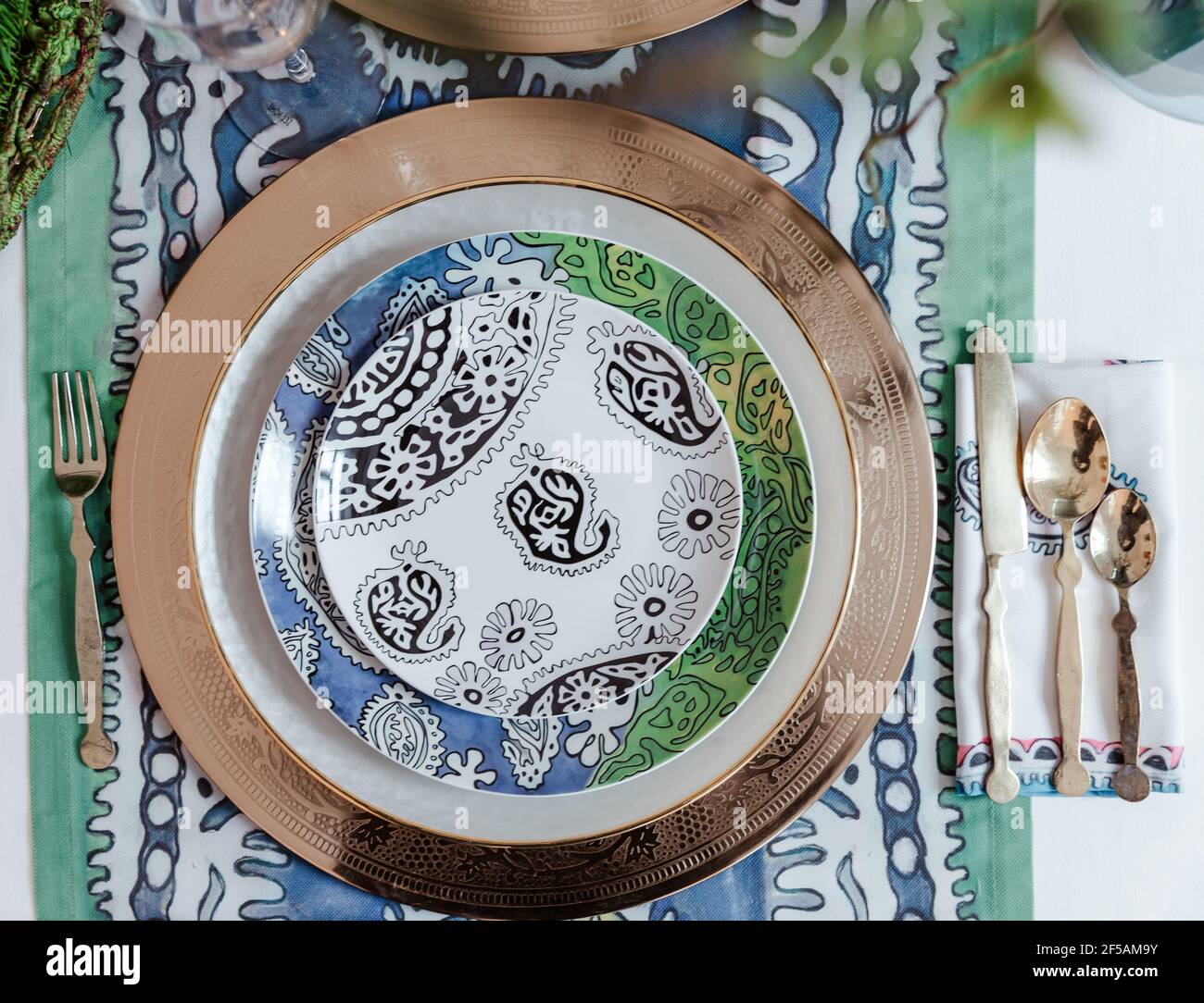 Top view of classic plates and utensils in a fine dining table setup ...