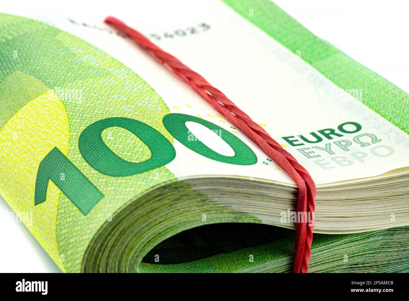 Macro shot of the European Union 100 EURO banknote, stack of banknotes ...