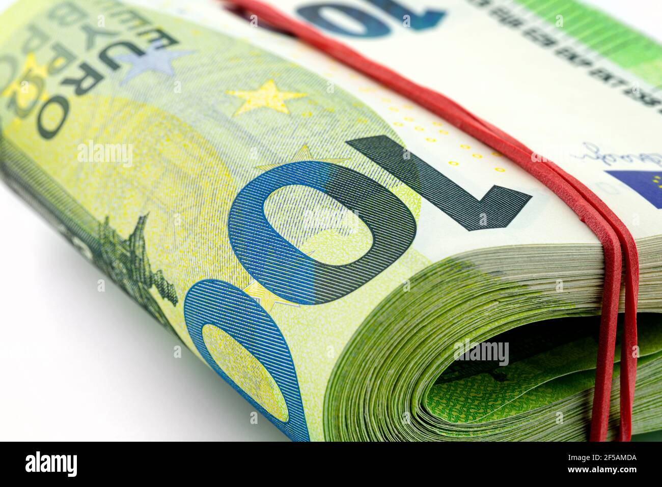 Macro shot of the European Union 100 EURO banknote, stack of banknotes ...