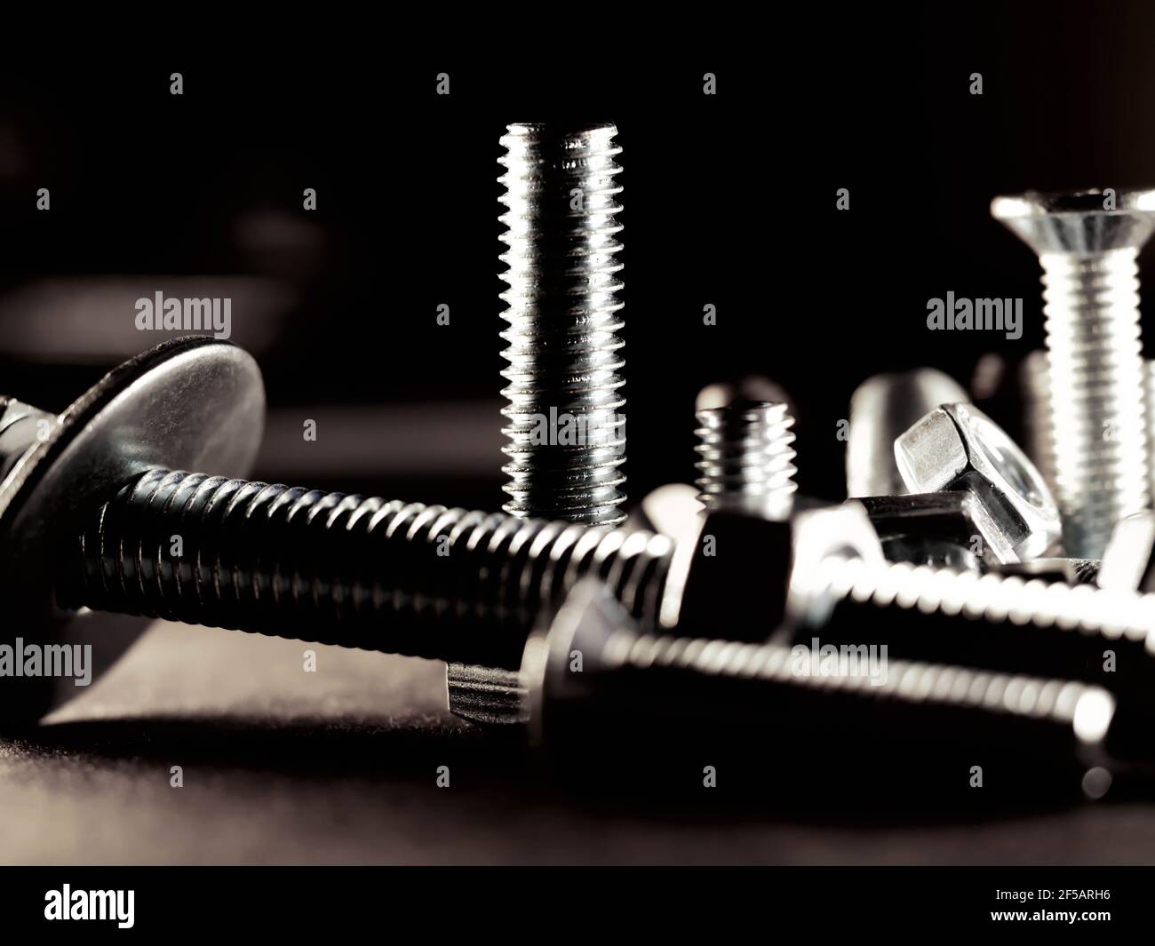Close-up of various steel nuts and bolts Stock Photo - Alamy