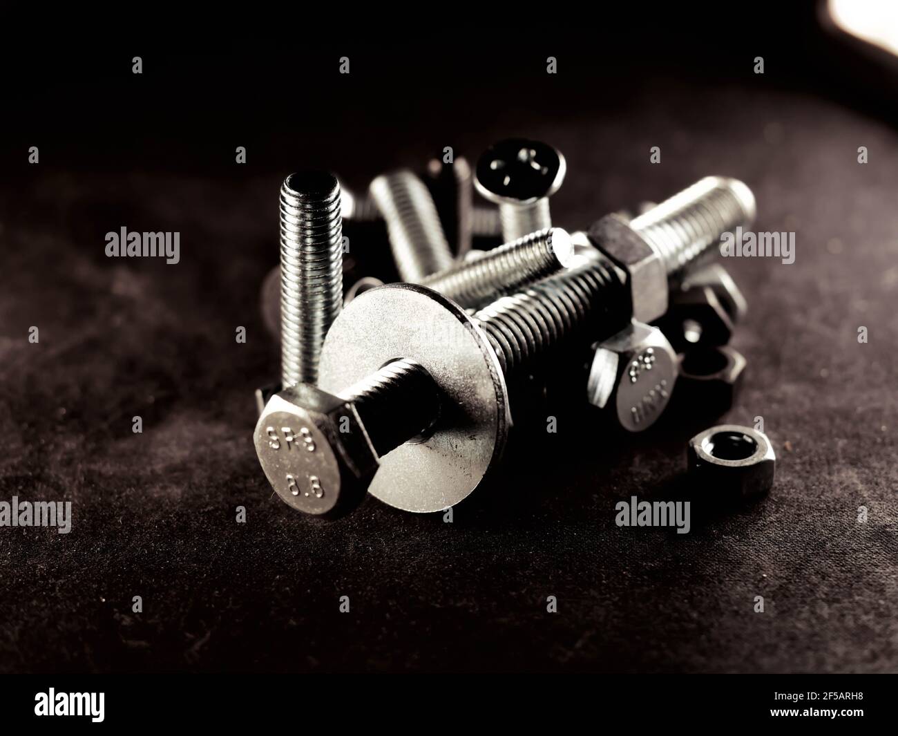 Close-up of various steel nuts and bolts Stock Photo - Alamy