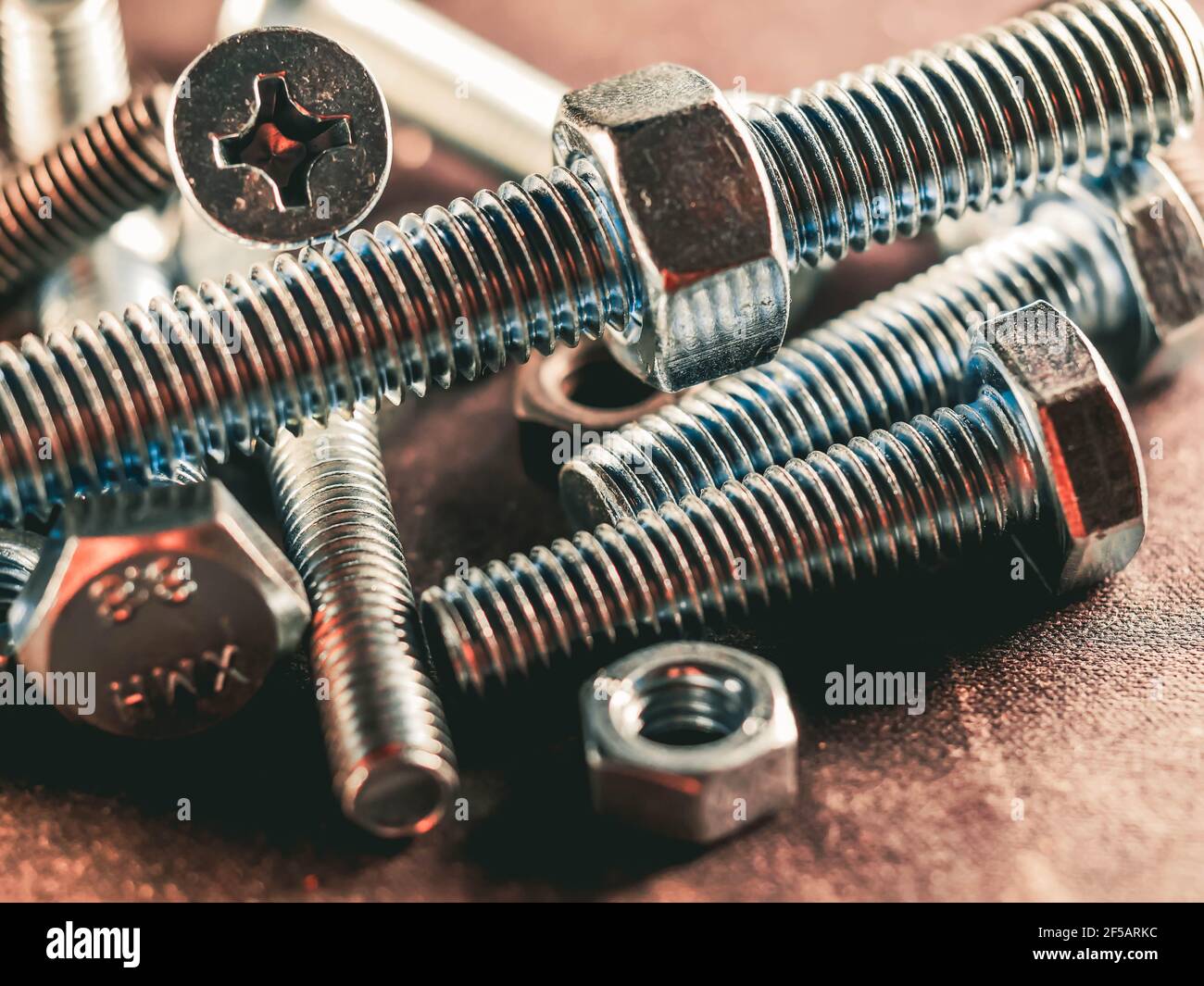 Close-up of various steel nuts and bolts Stock Photo - Alamy