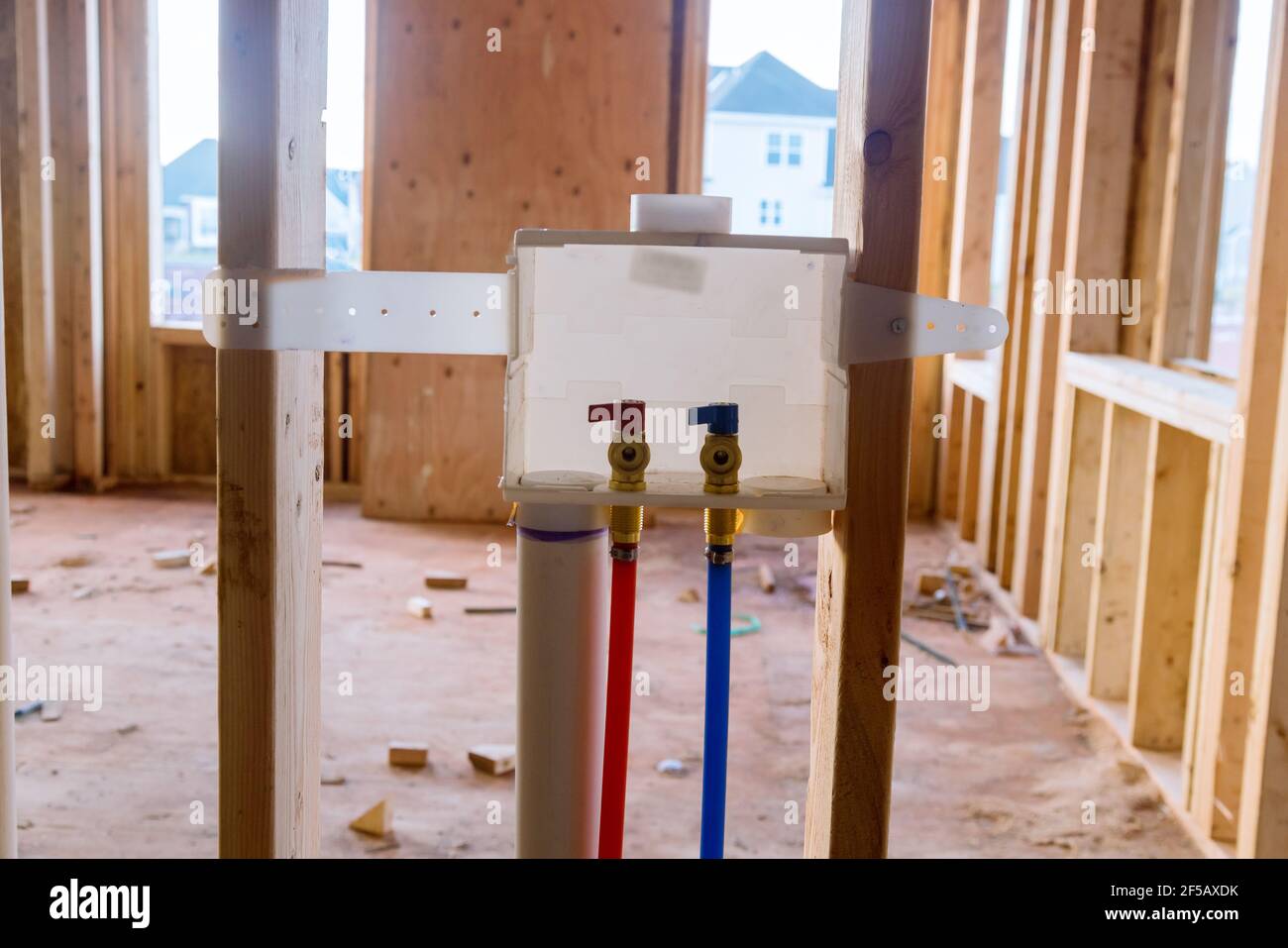 Installation of a laundry outlet boxes in a new house for connection of ...