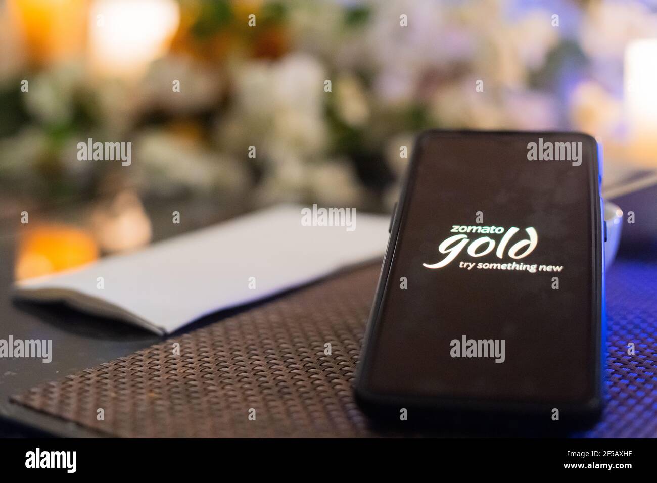 mobile phone with the foodtech app startup Zomato gold pro open ...