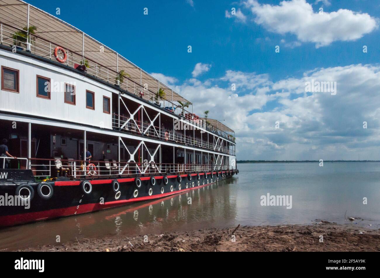 A nostalgic colonial-style ship is anchored on the banks of the Mekong ...
