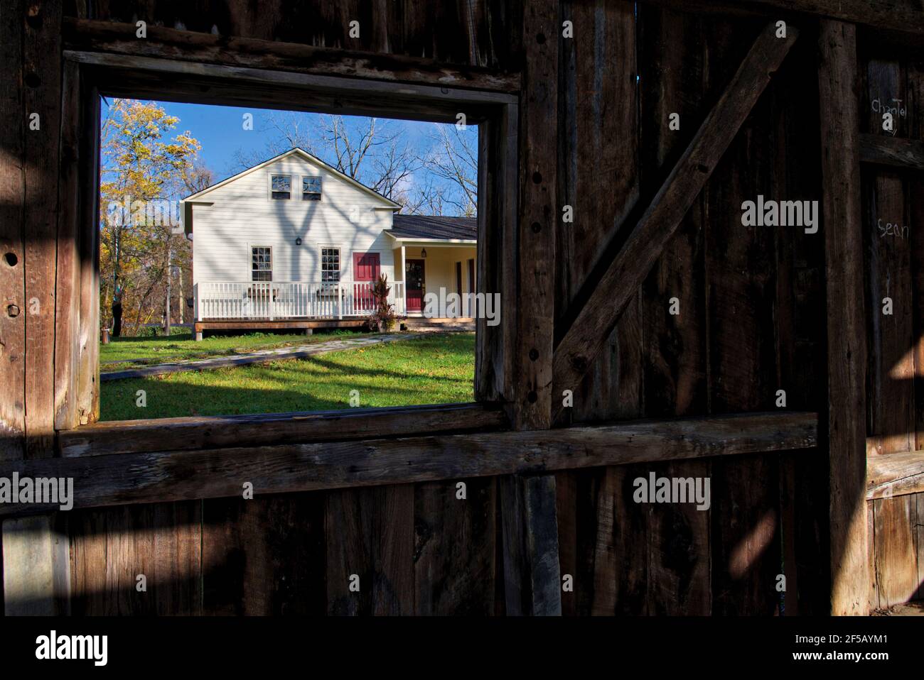 Looking through the window of an empty damaged barn Stock Photo - Alamy