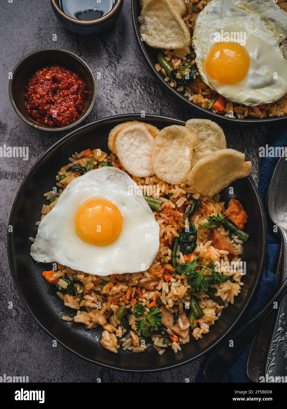 Indonesian Fried Rice Nasi Goreng served with soya sauce, chilli paste ...